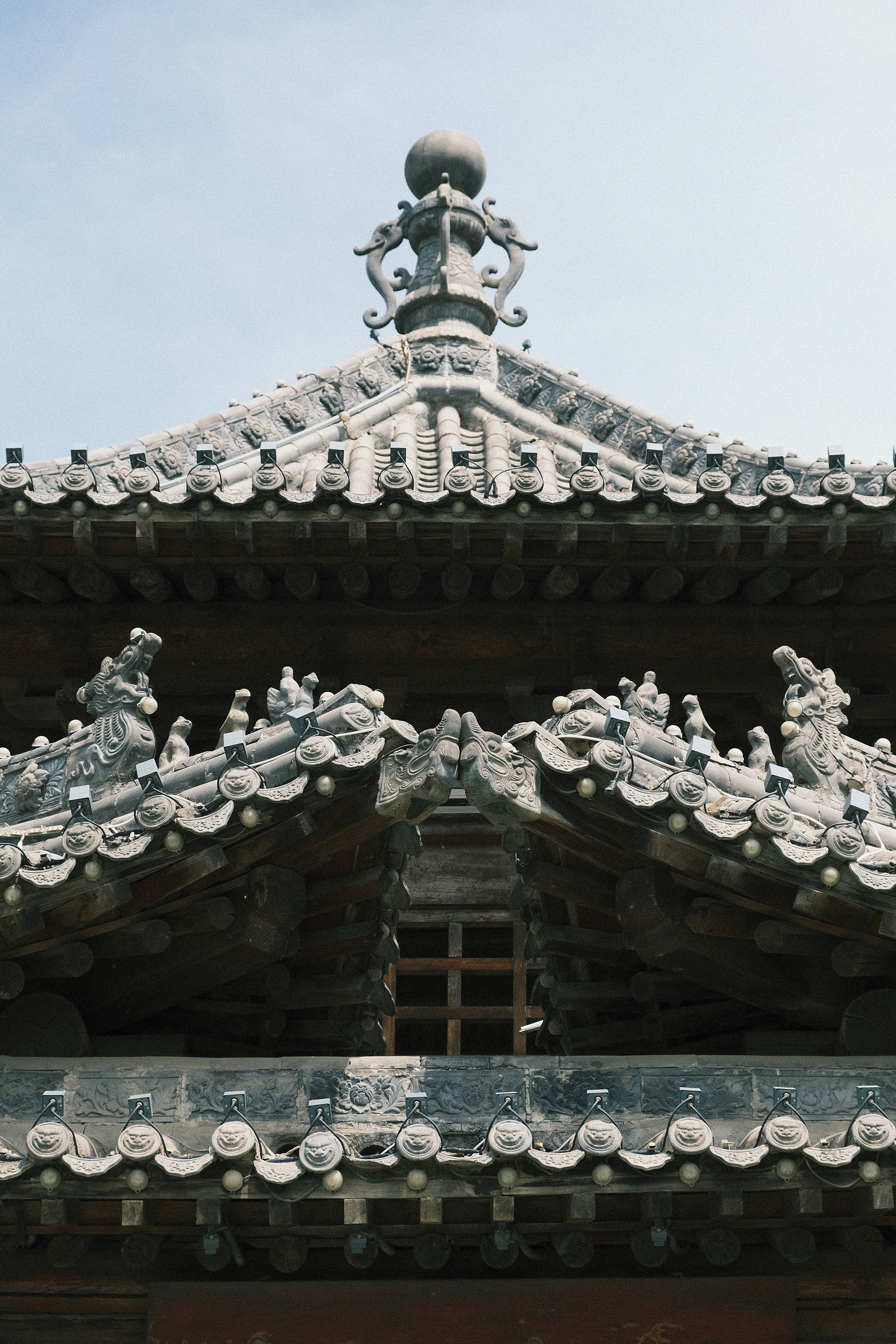 Dragon-Guarded Eaves: Carved Tiles and Terraced Roofs of a Historic Temple