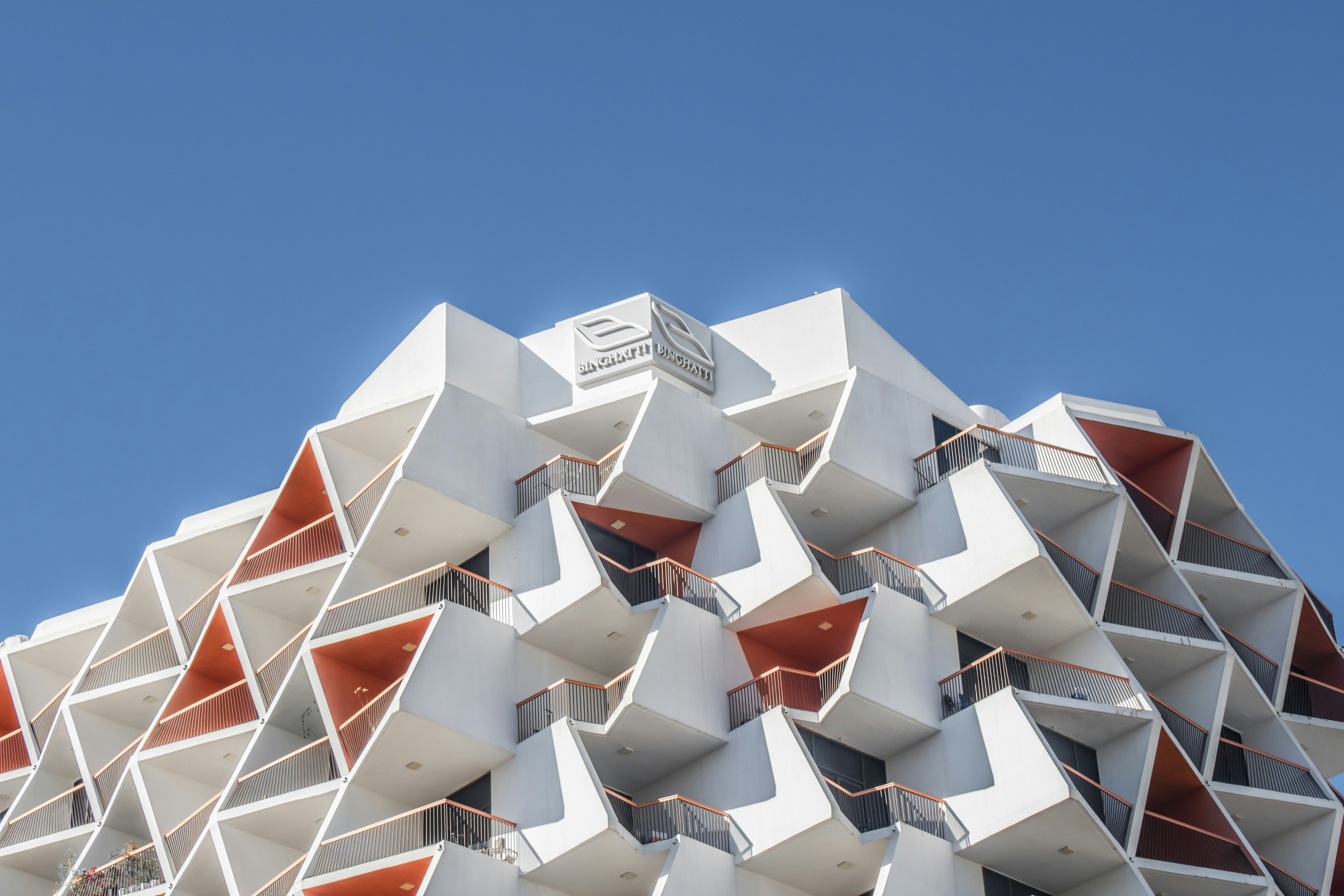 A very tall building with many balconies on it photo – Free Dubai ...