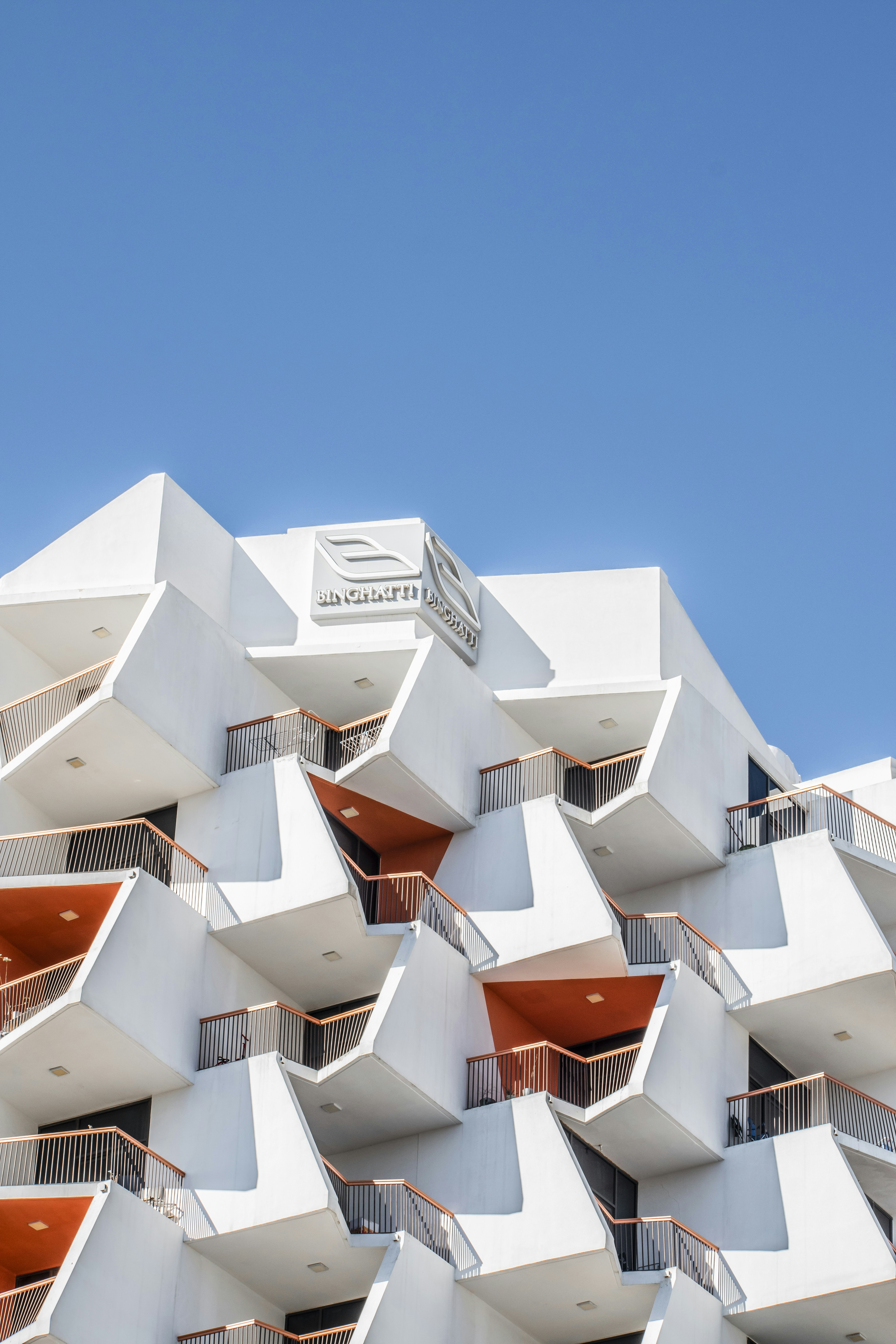 A tall white building with balconies and balconies photo – Free Dubai ...