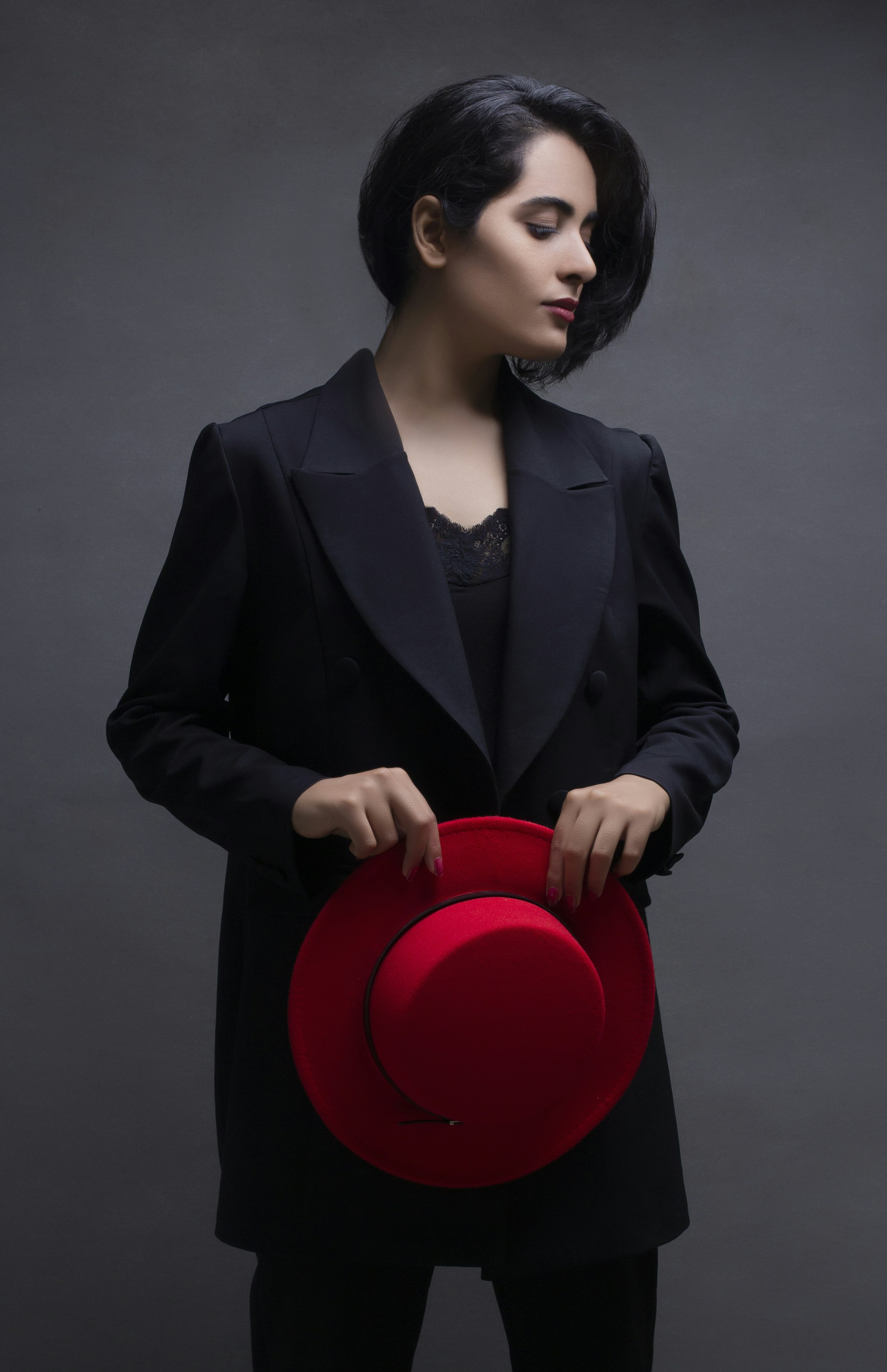 Crimson Bowler, Noir Confidence: A Portrait in Silhouette