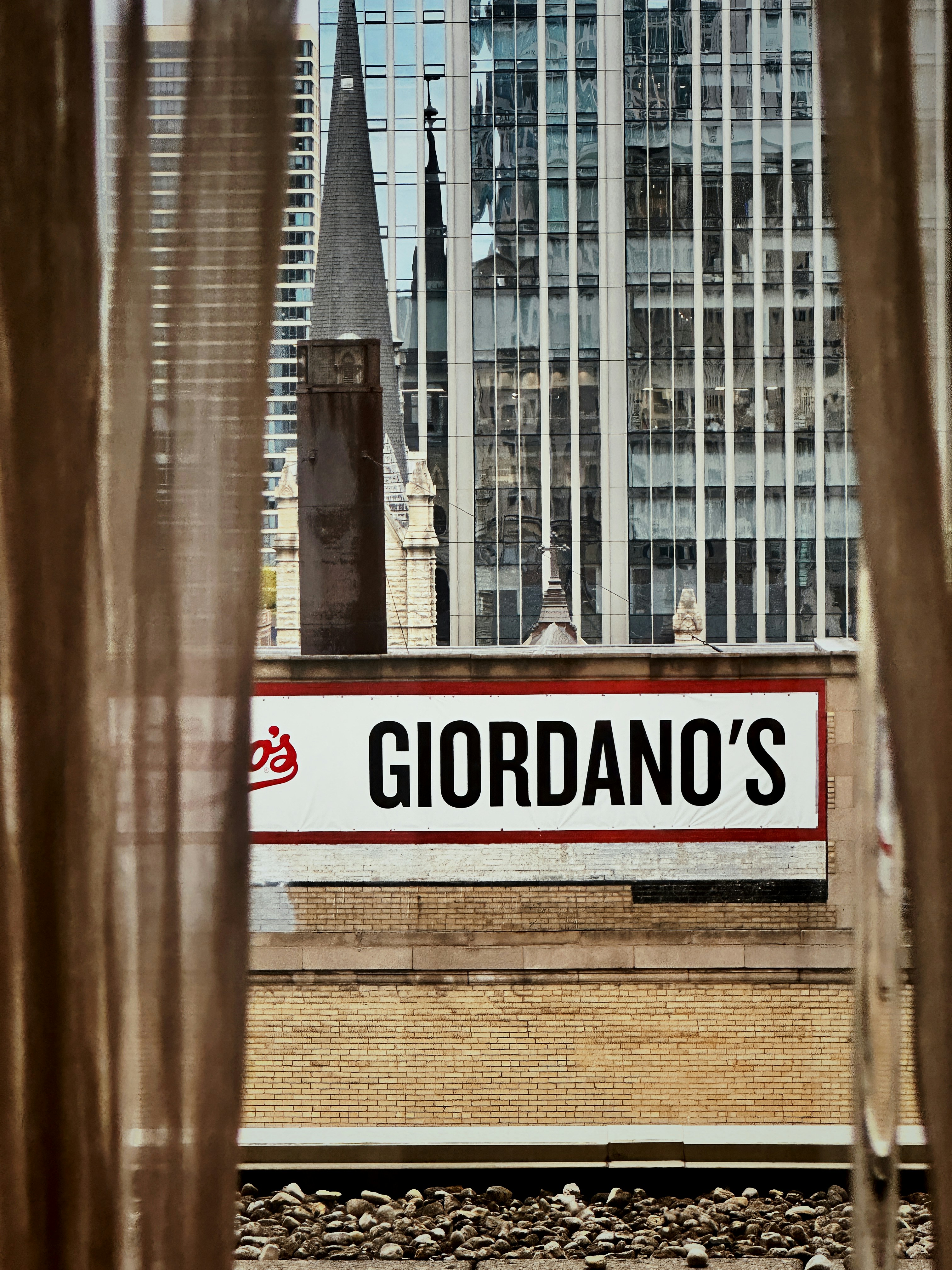 There is a sign that says giordano's on the side of a photo – Free ...