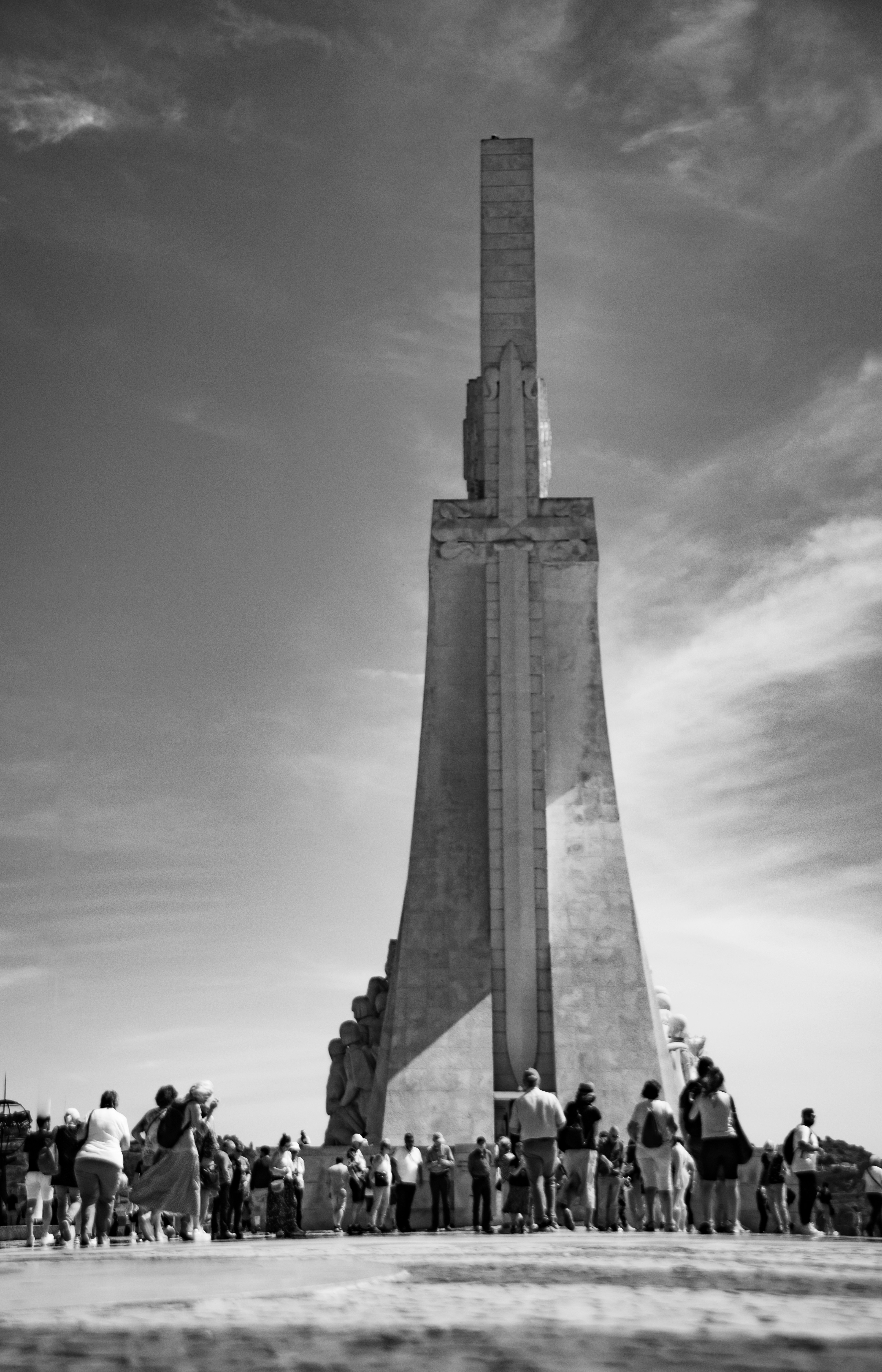 Vertical Majesty: Crowds Converge at the Foot of a Monumental Obelisk