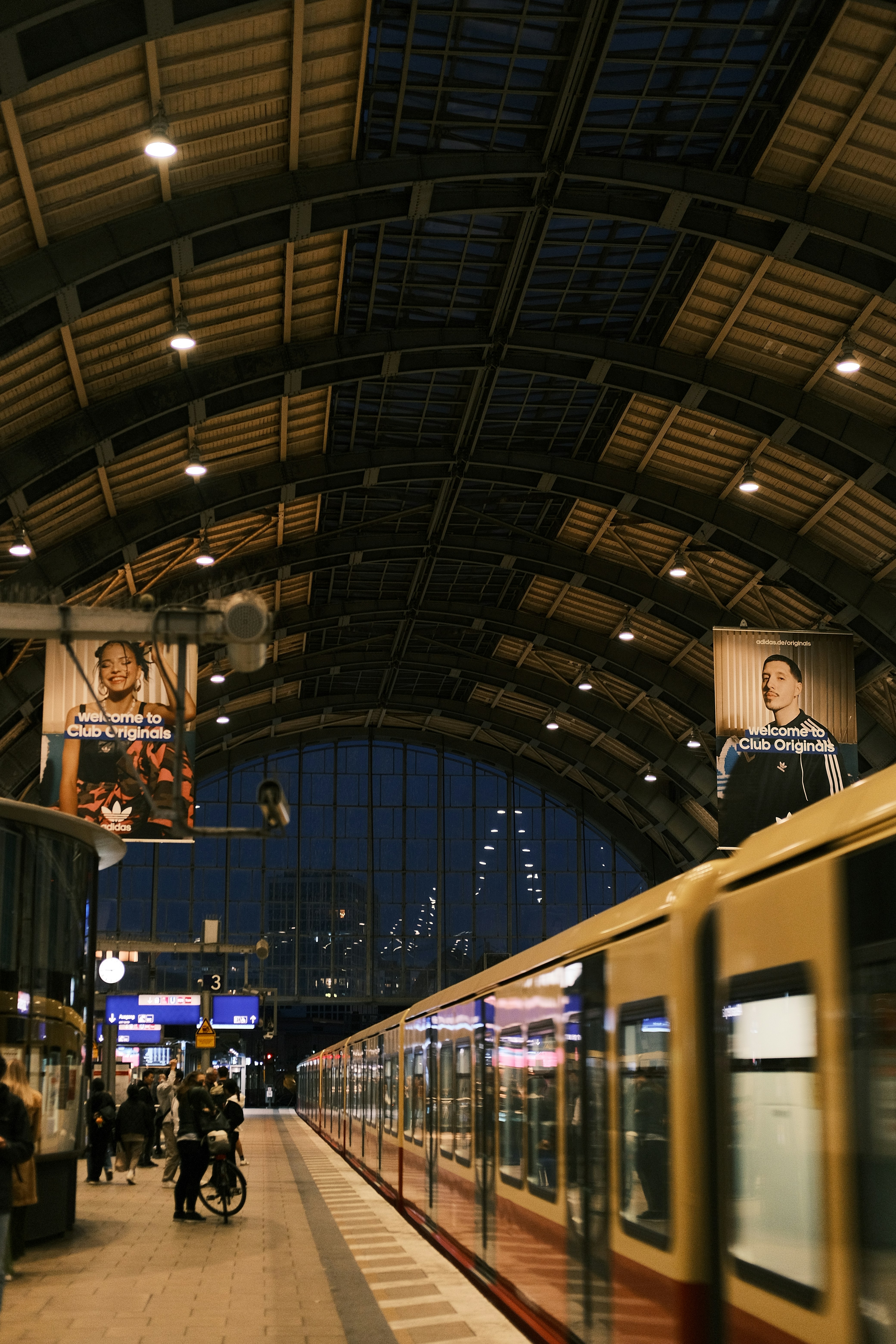 Midnight Arch: A Yellow Train Glides Through a Glass-Cathedral Station