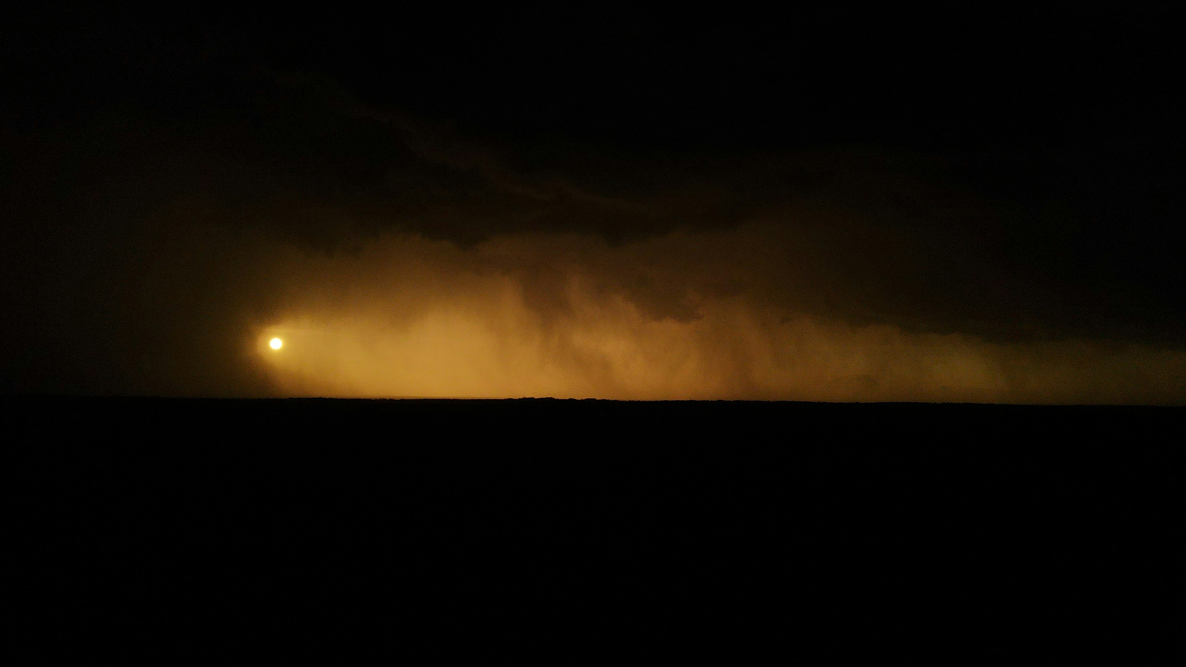 A dark sky with a light in the distance photo – Free Covington Image on ...