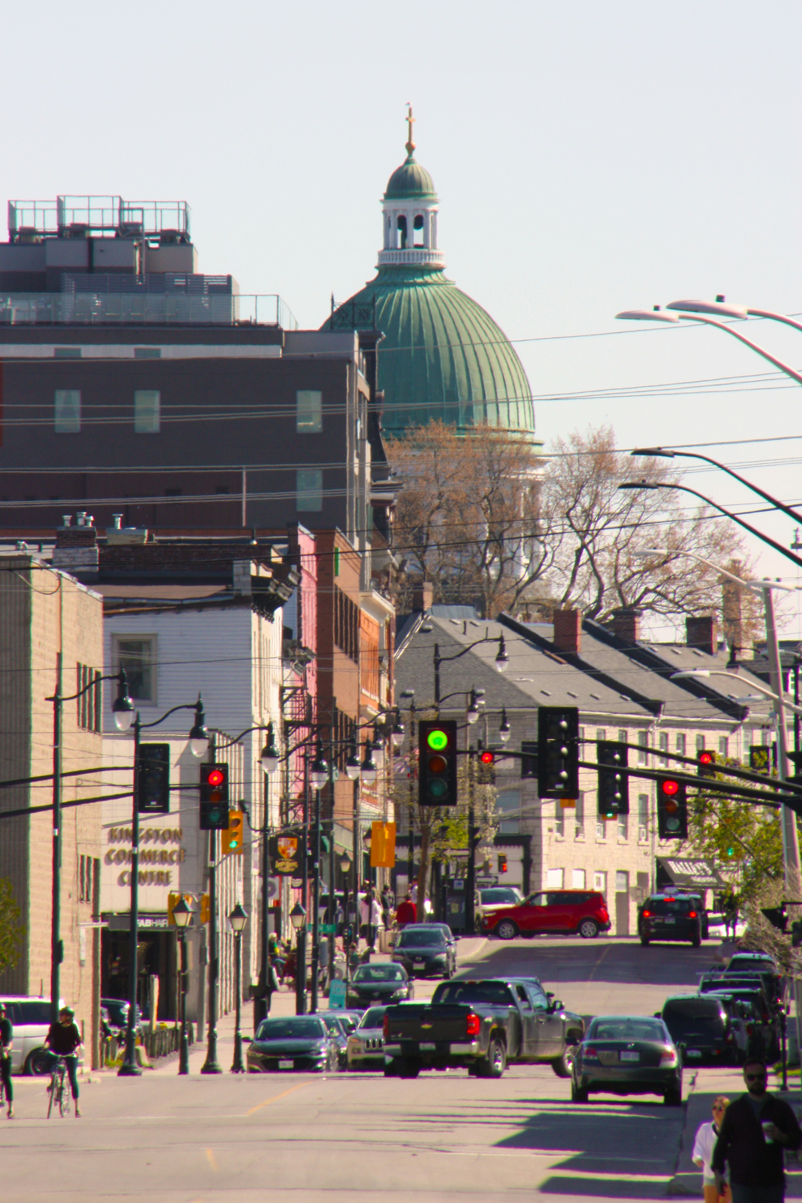 A city street filled with lots of traffic next to tall buildings photo ...