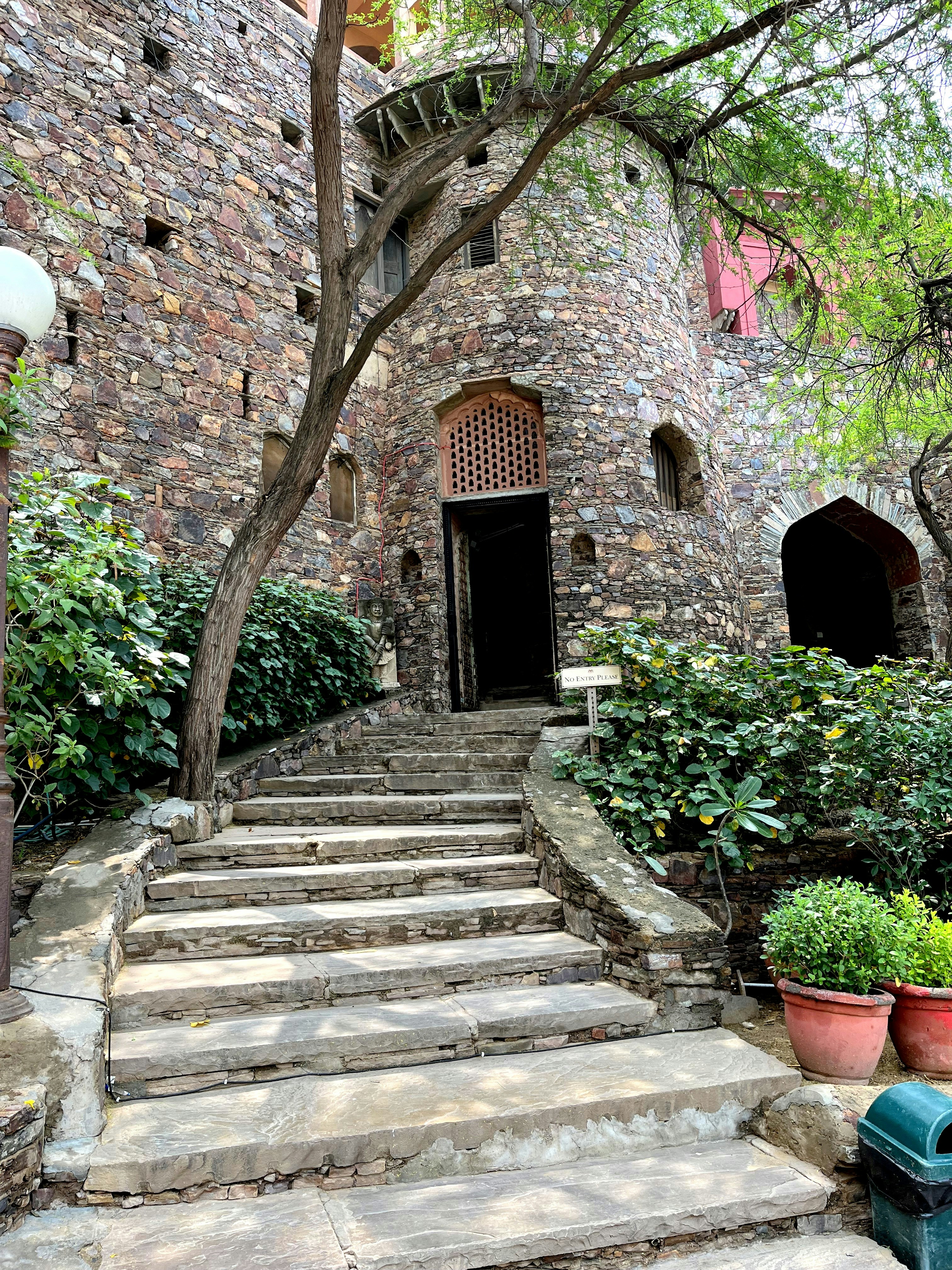 Stone Staircase to a Hidden Doorway in a Medieval Courtyard