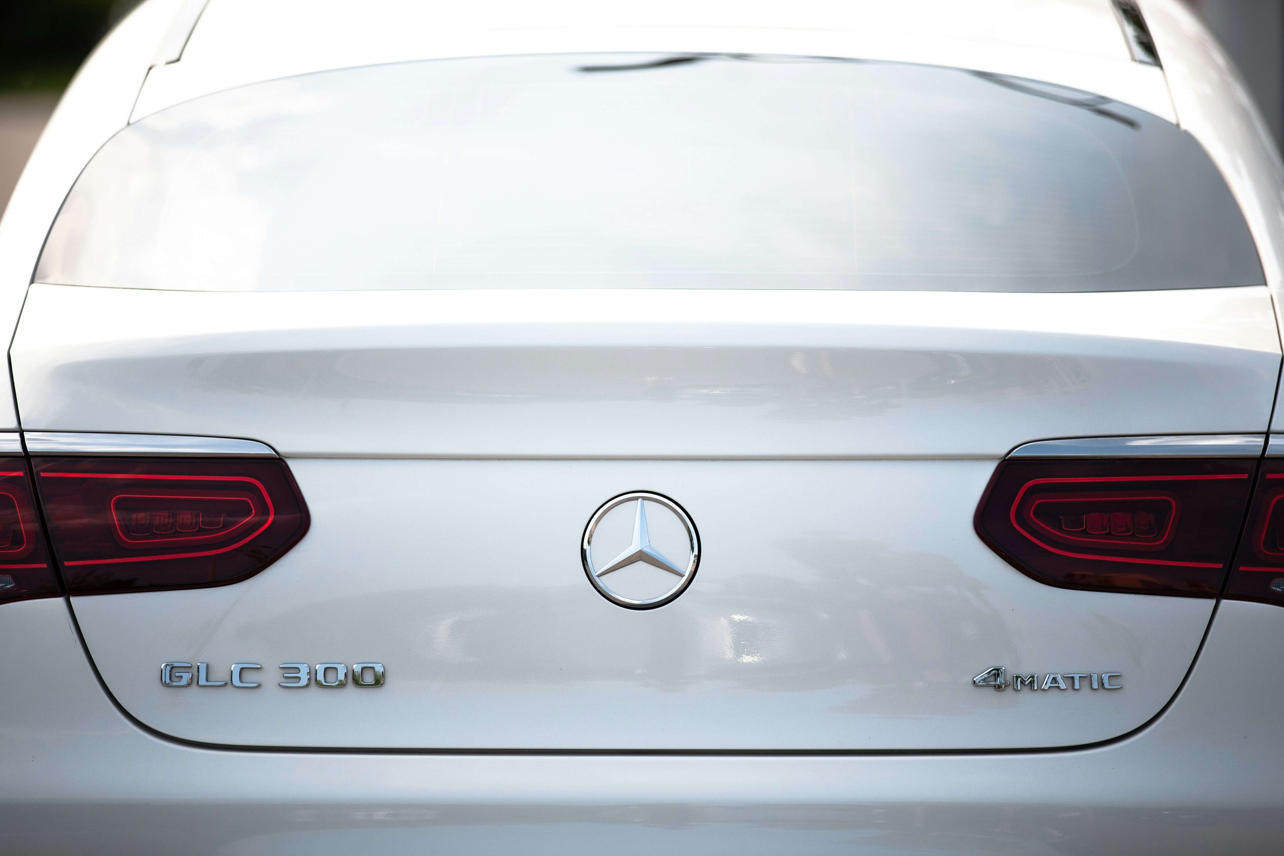 Center Emblem Symphony: Rear View of a White Mercedes-Benz GLC 300