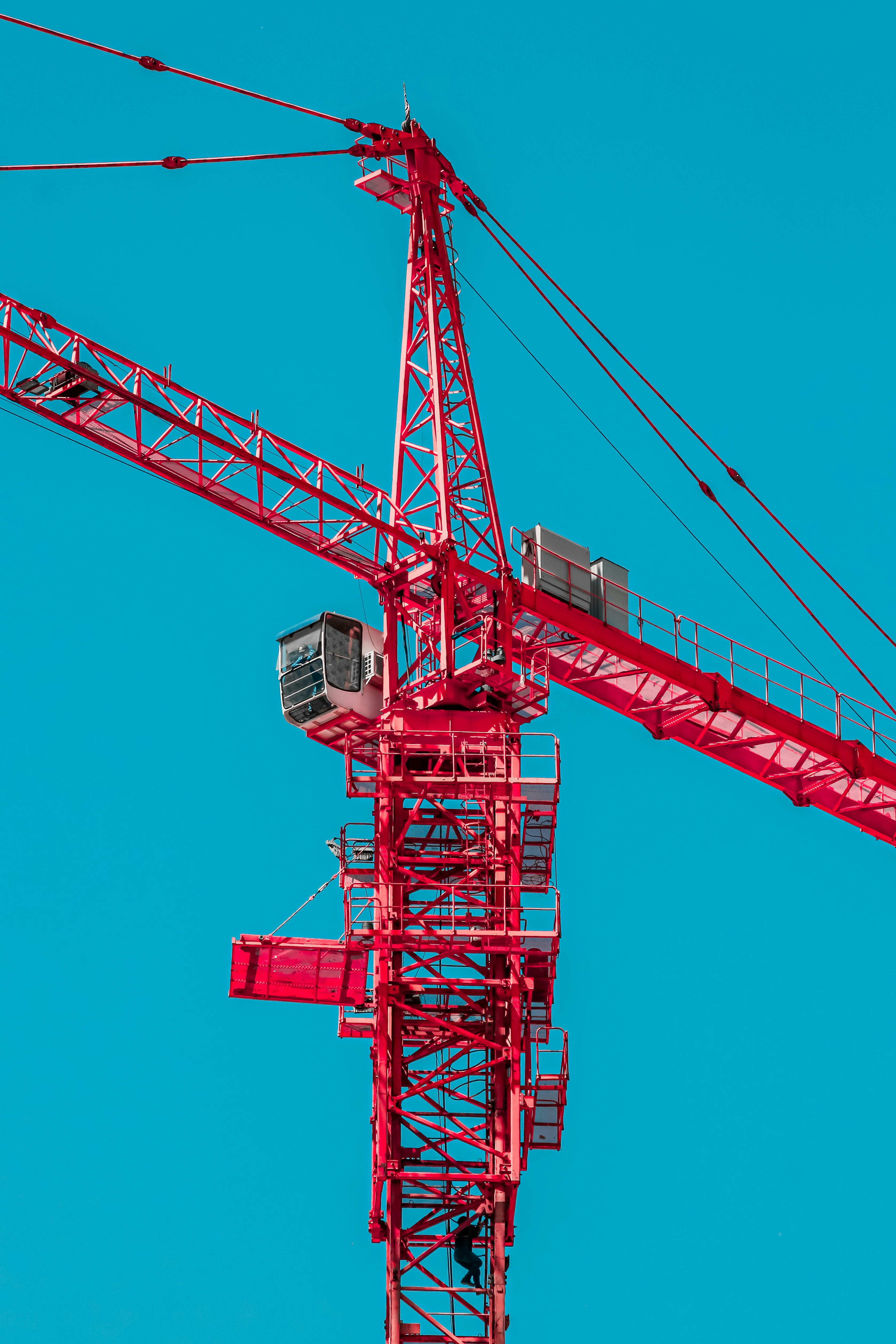 A large red crane is against a blue sky photo – Free Tehran Image on ...