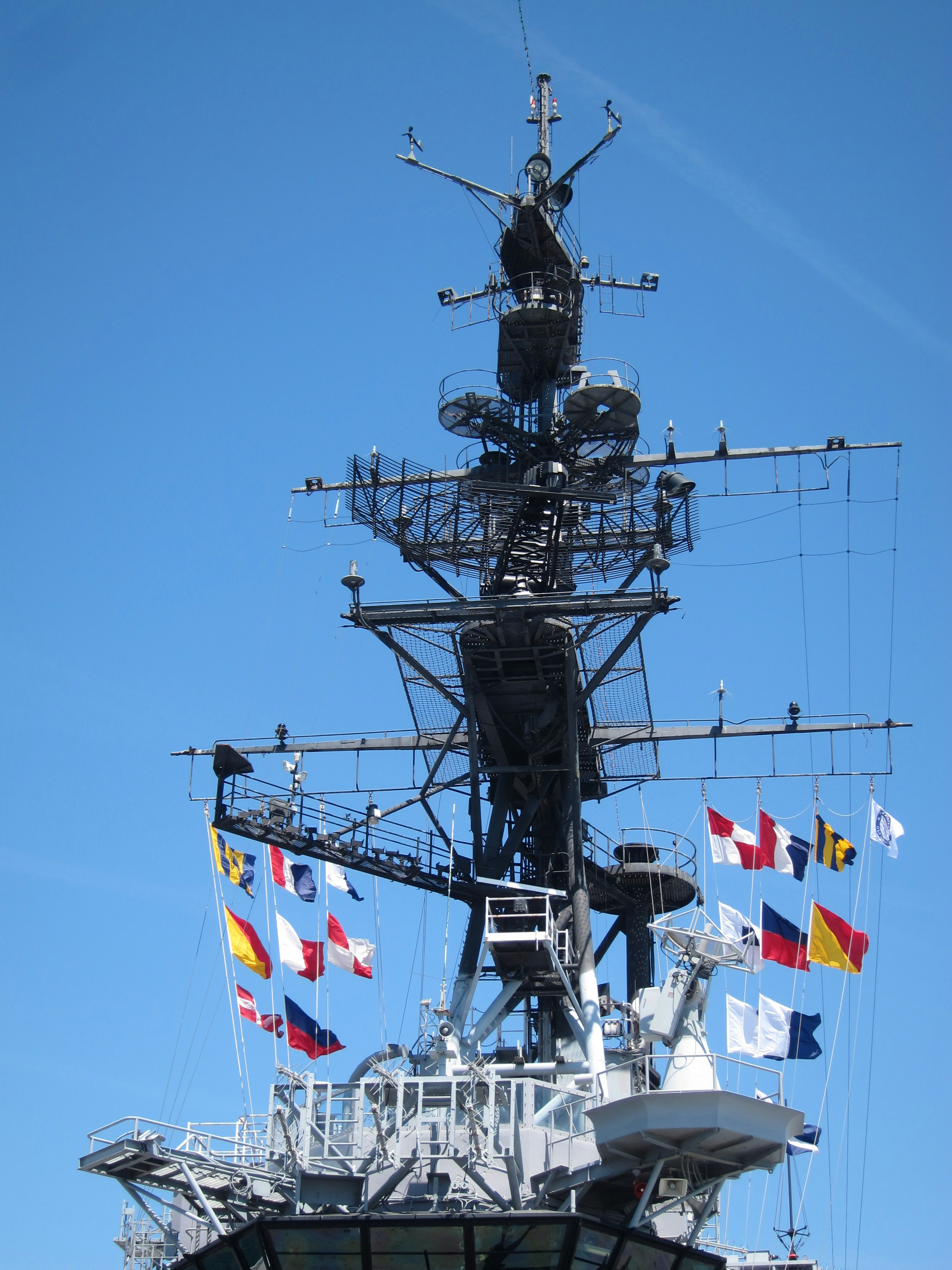 A large ship with a lot of flags on it photo – Free Uss midway Image on ...