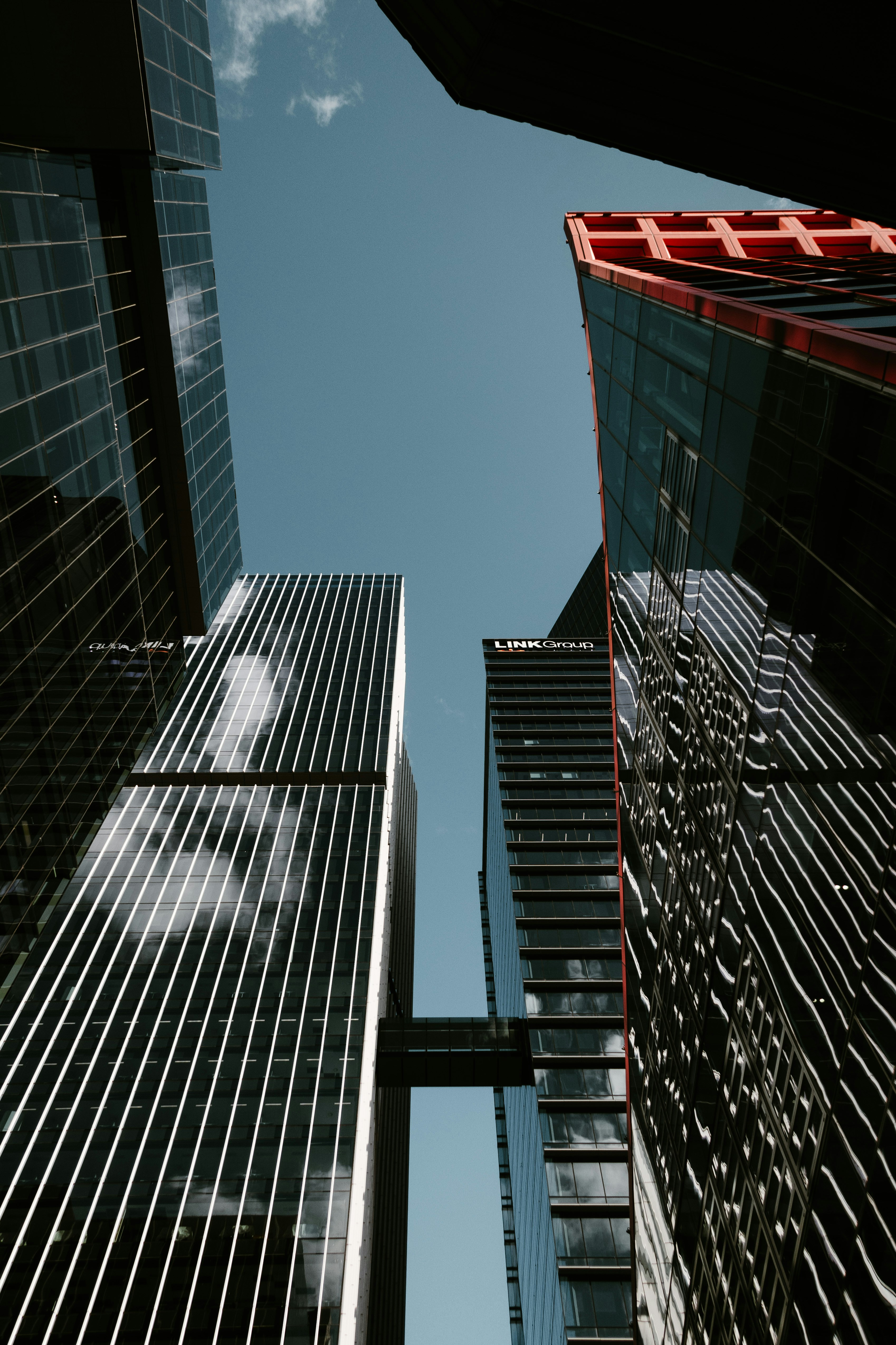 A couple of tall buildings next to each other photo – Free City Image ...