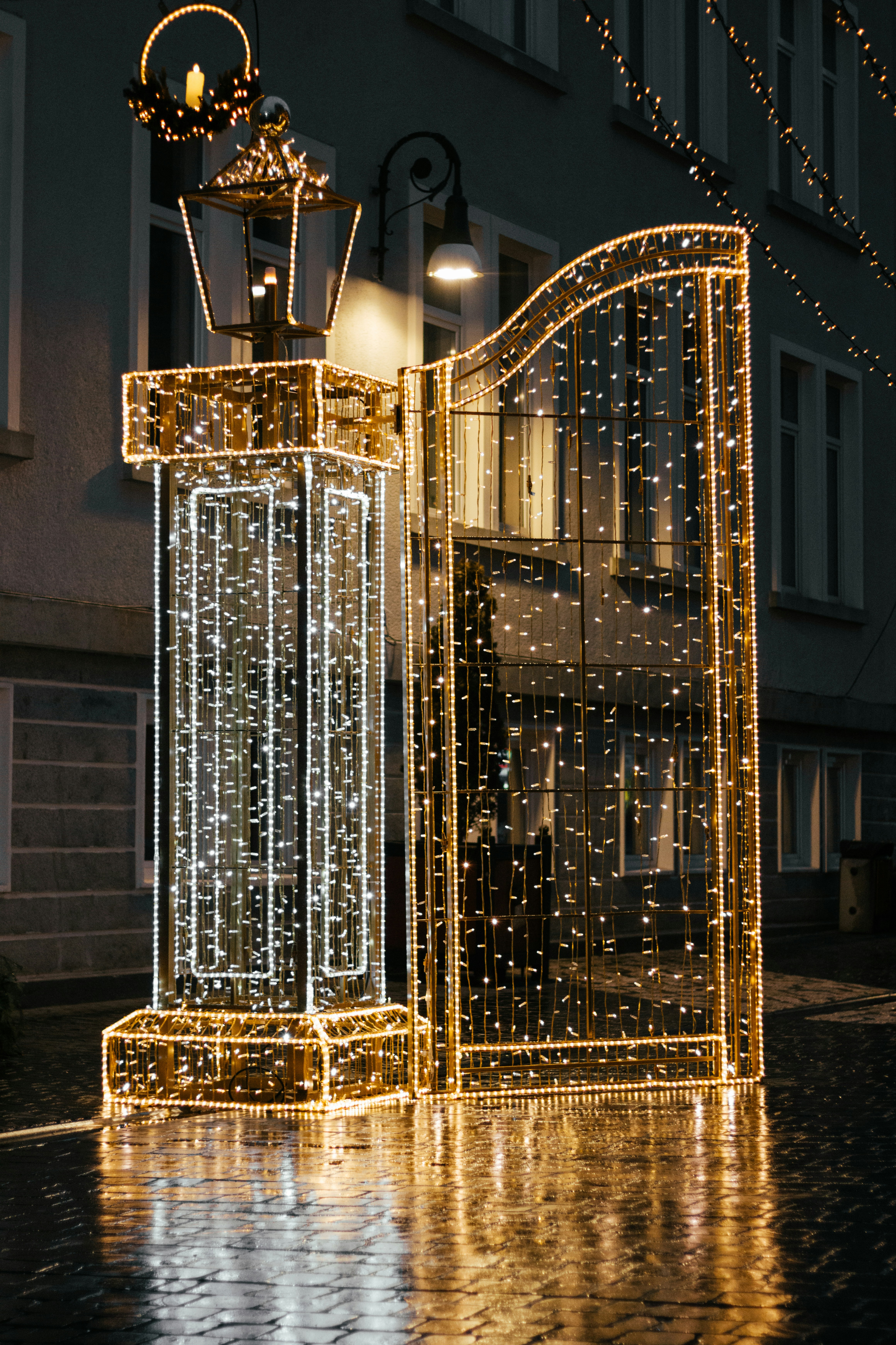A lighted gate on a city street at night photo – Free Romania Image on ...