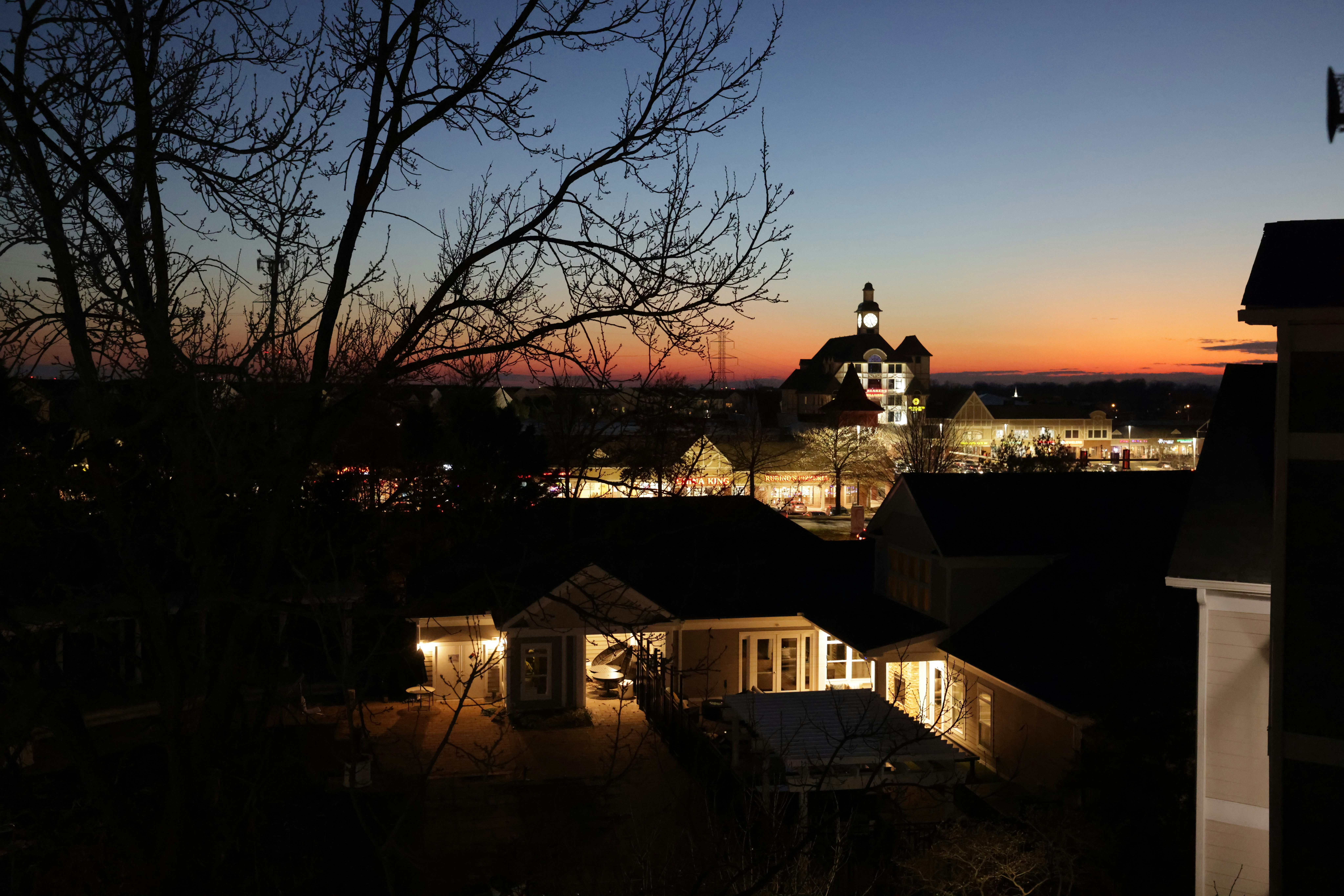 a view of a city at night from a rooftop