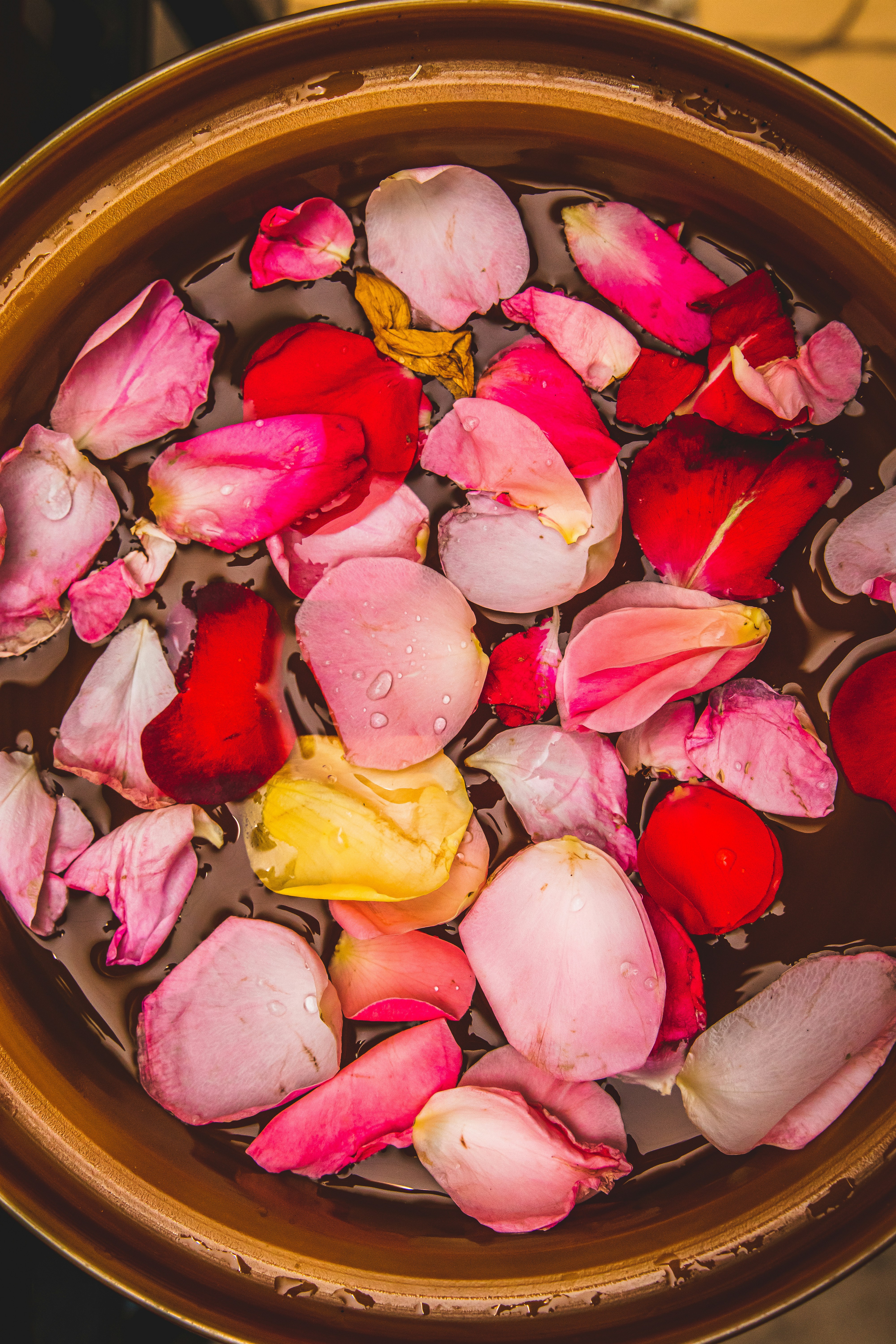 Petal Mosaic: Floating Blush in a Clay Vessel