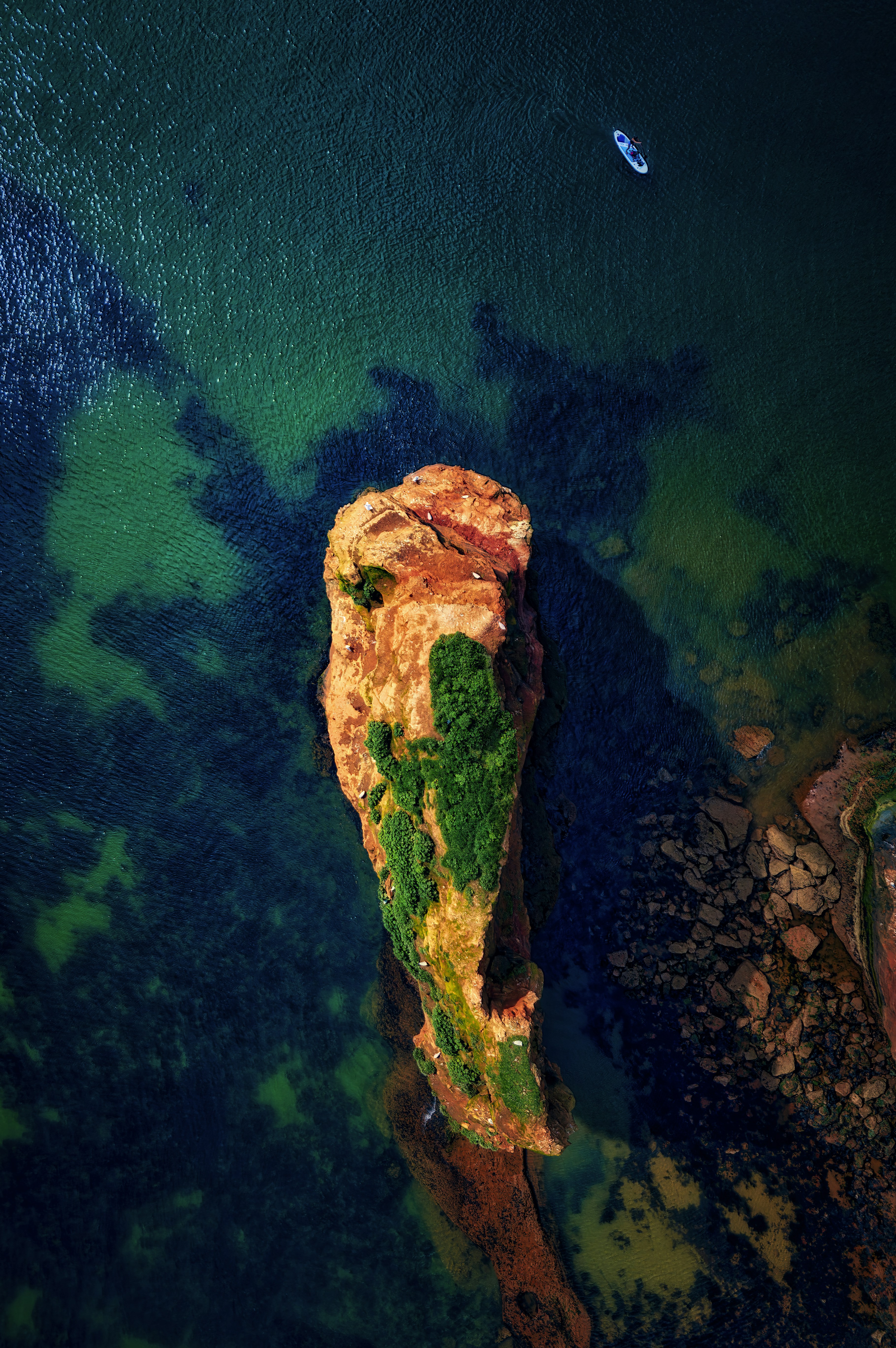 Emerald-veined Promontory Rising from Turquoise Waters