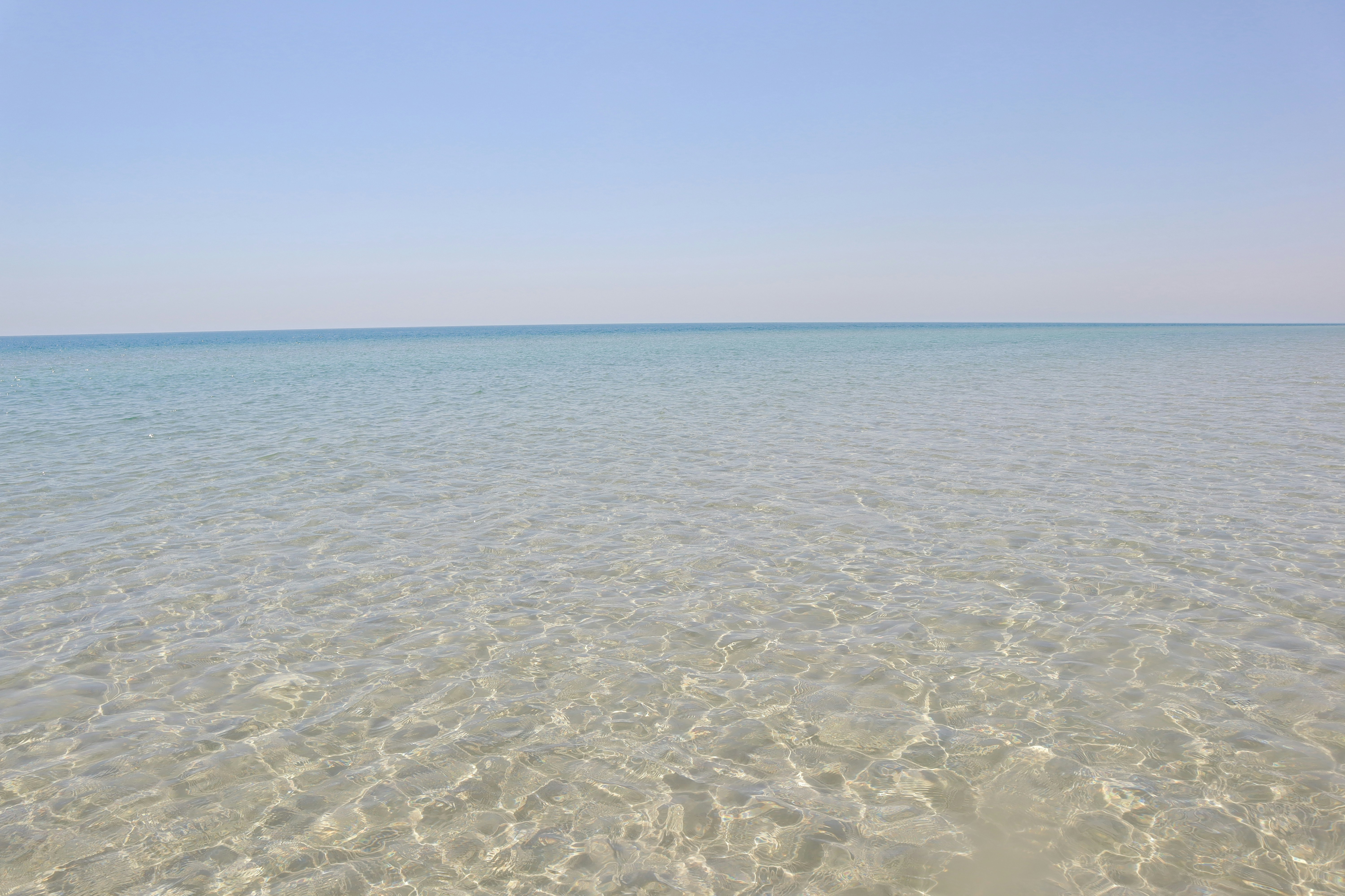 A body of water with a sky background photo – Free Sealine beach Image ...