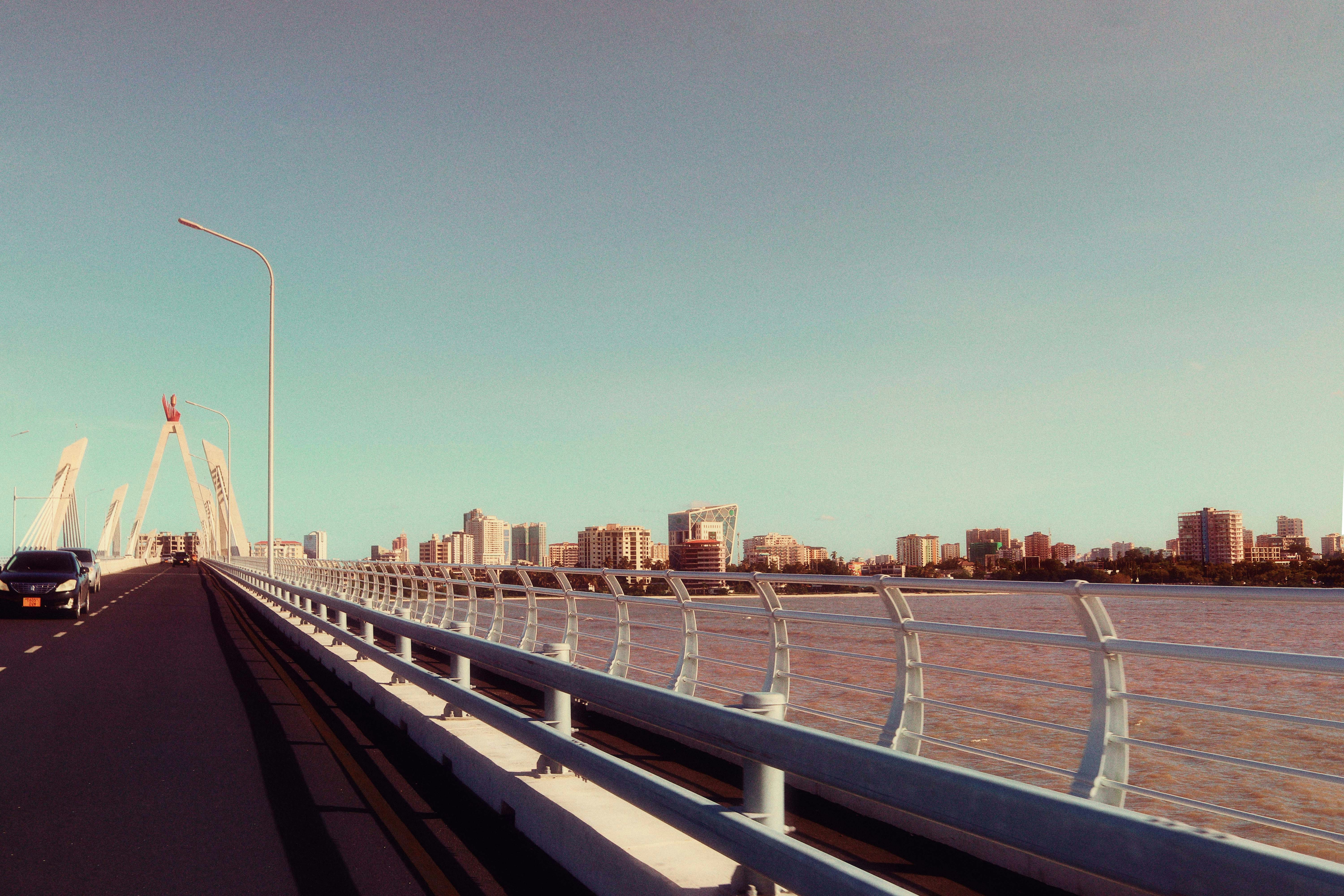 A car driving on a bridge over a body of water photo – Free Ali hassan ...