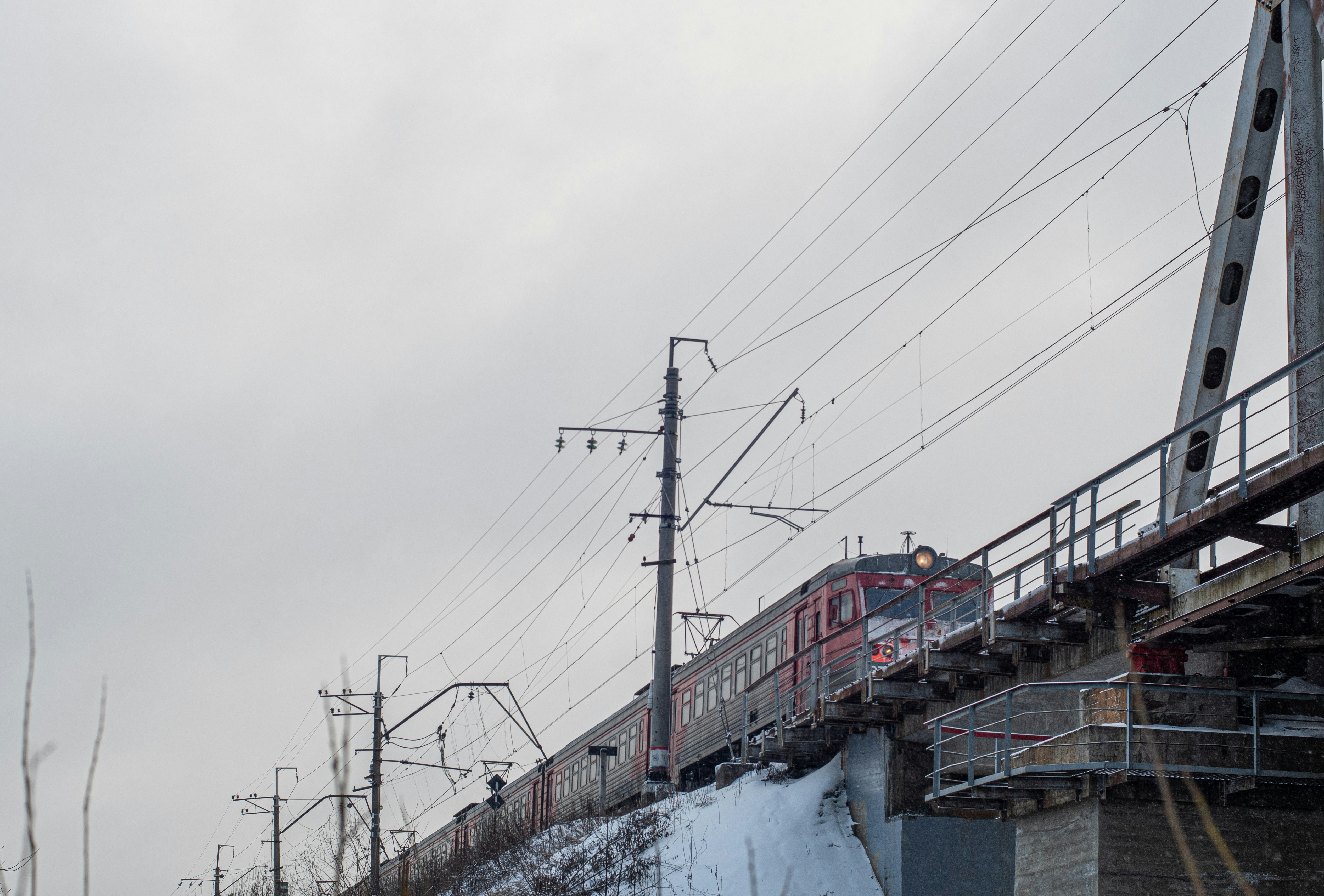 Crimson Locomotive Hauling Through a Frosted Viaduct