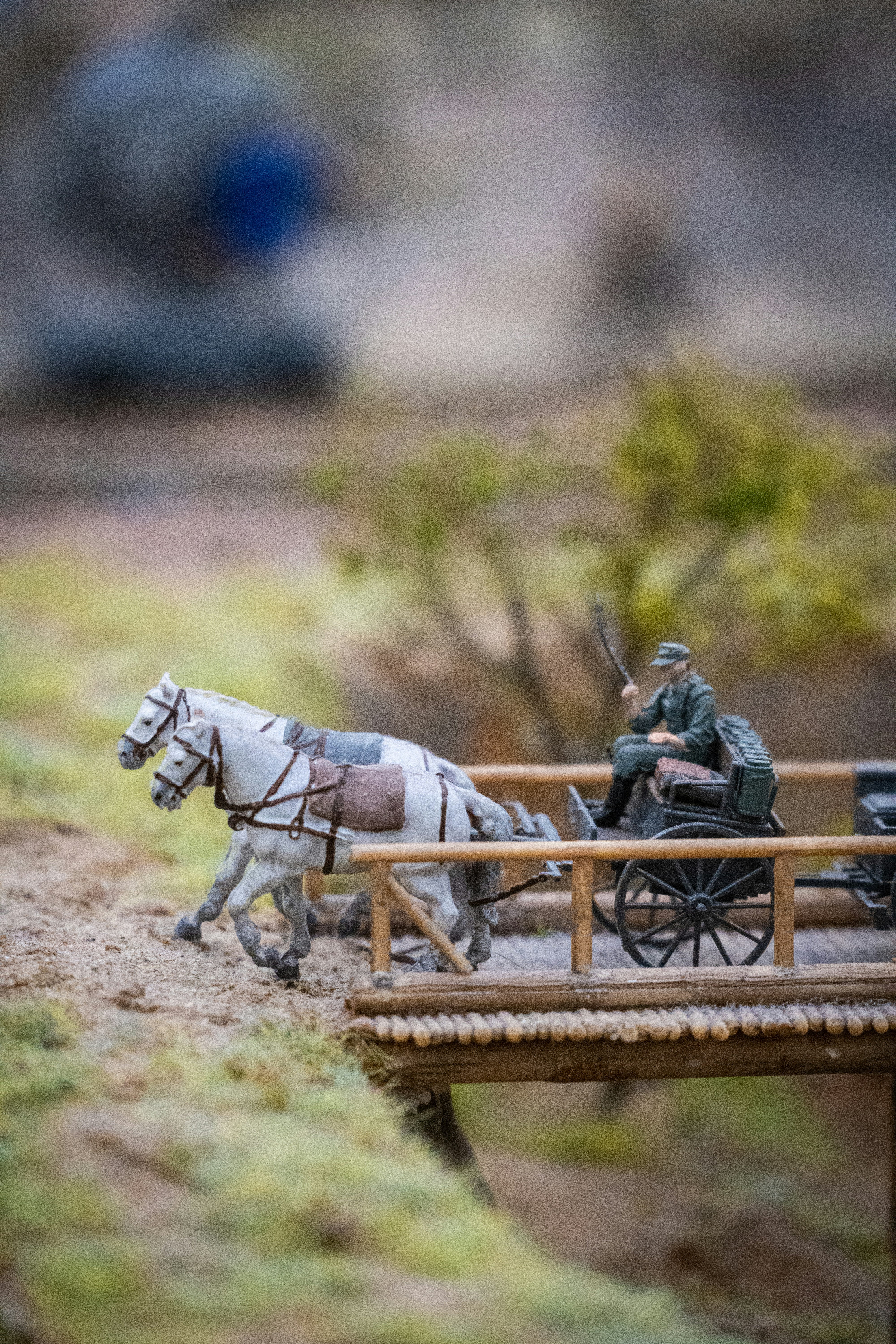 Miniature Wagon Crossing: A Horse-Drawn Scene Traverses a Quiet Bridge