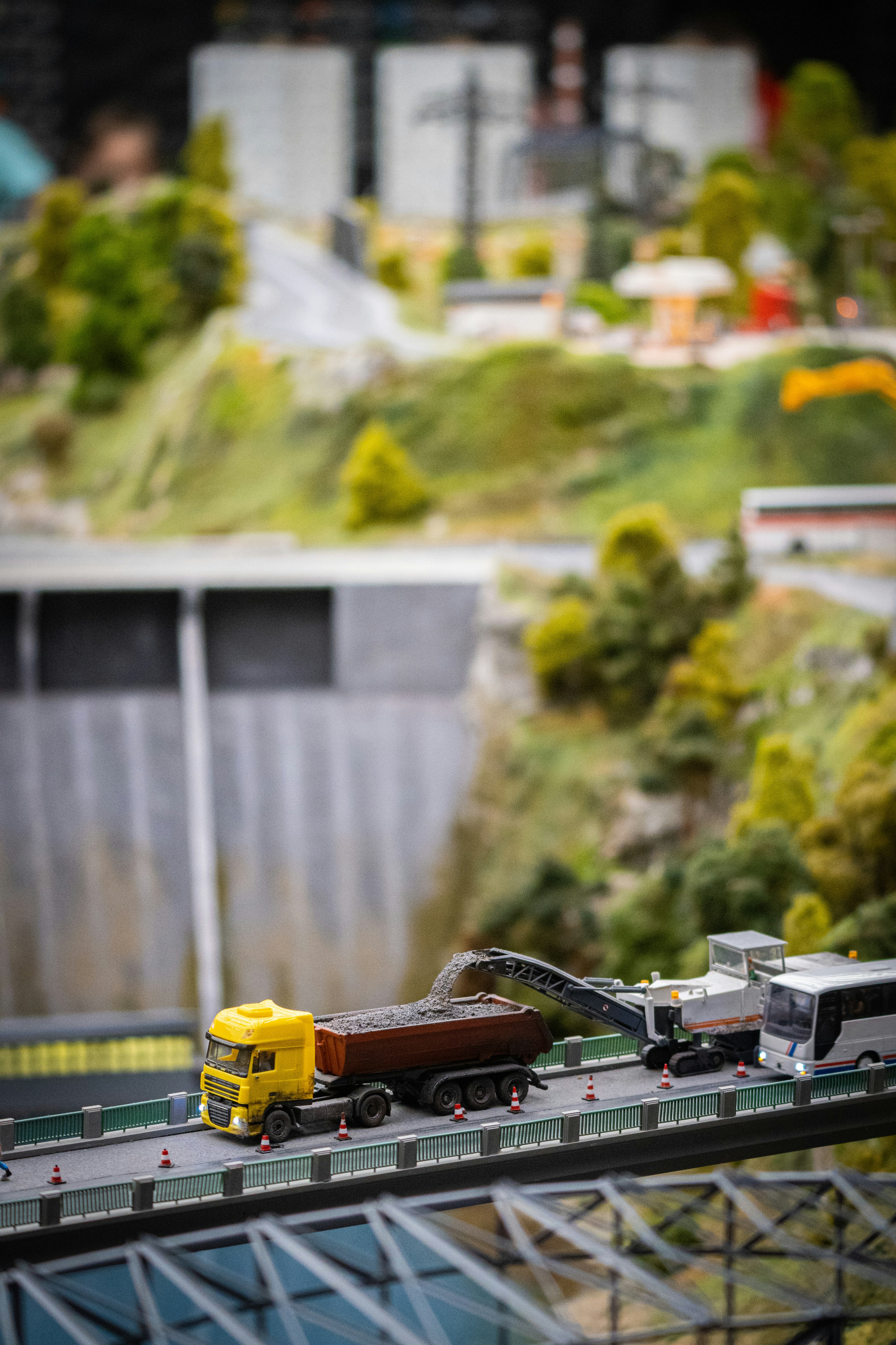 Miniature Highway Tale: A Yellow Truck and Crane Bridge