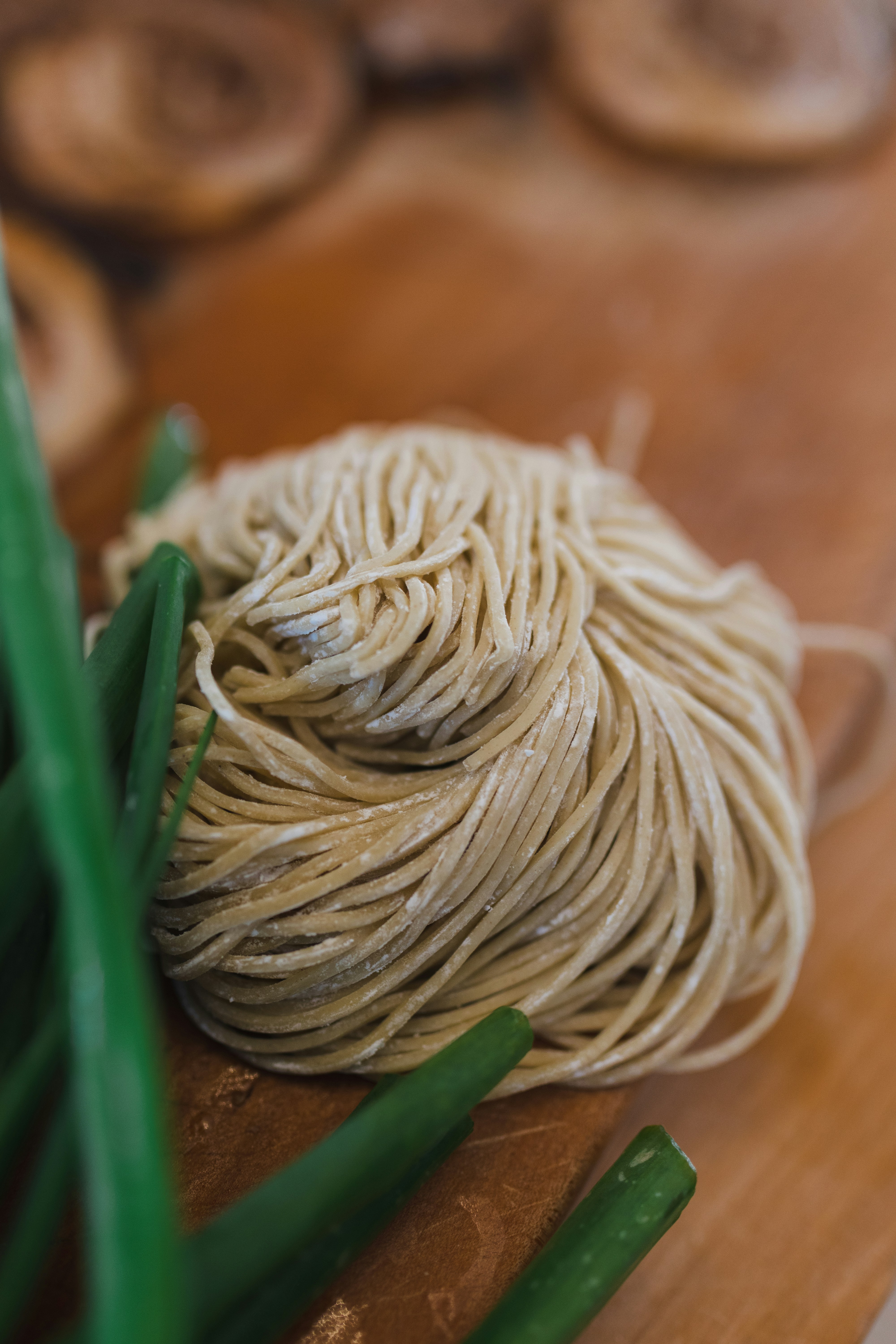Coiled Silk Noodles on a Wooden Stage