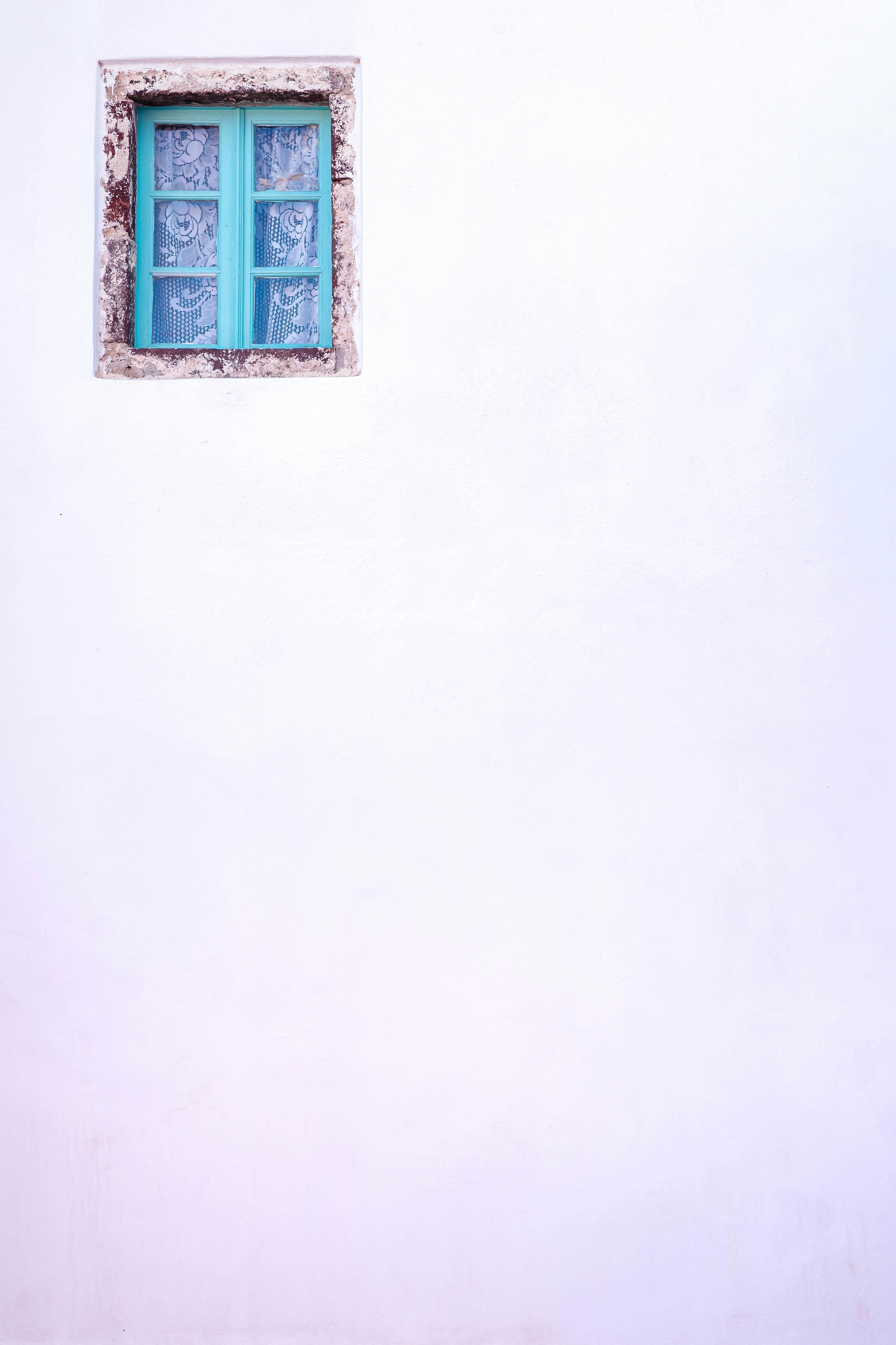 Aqua-framed Window on a Pale Wall