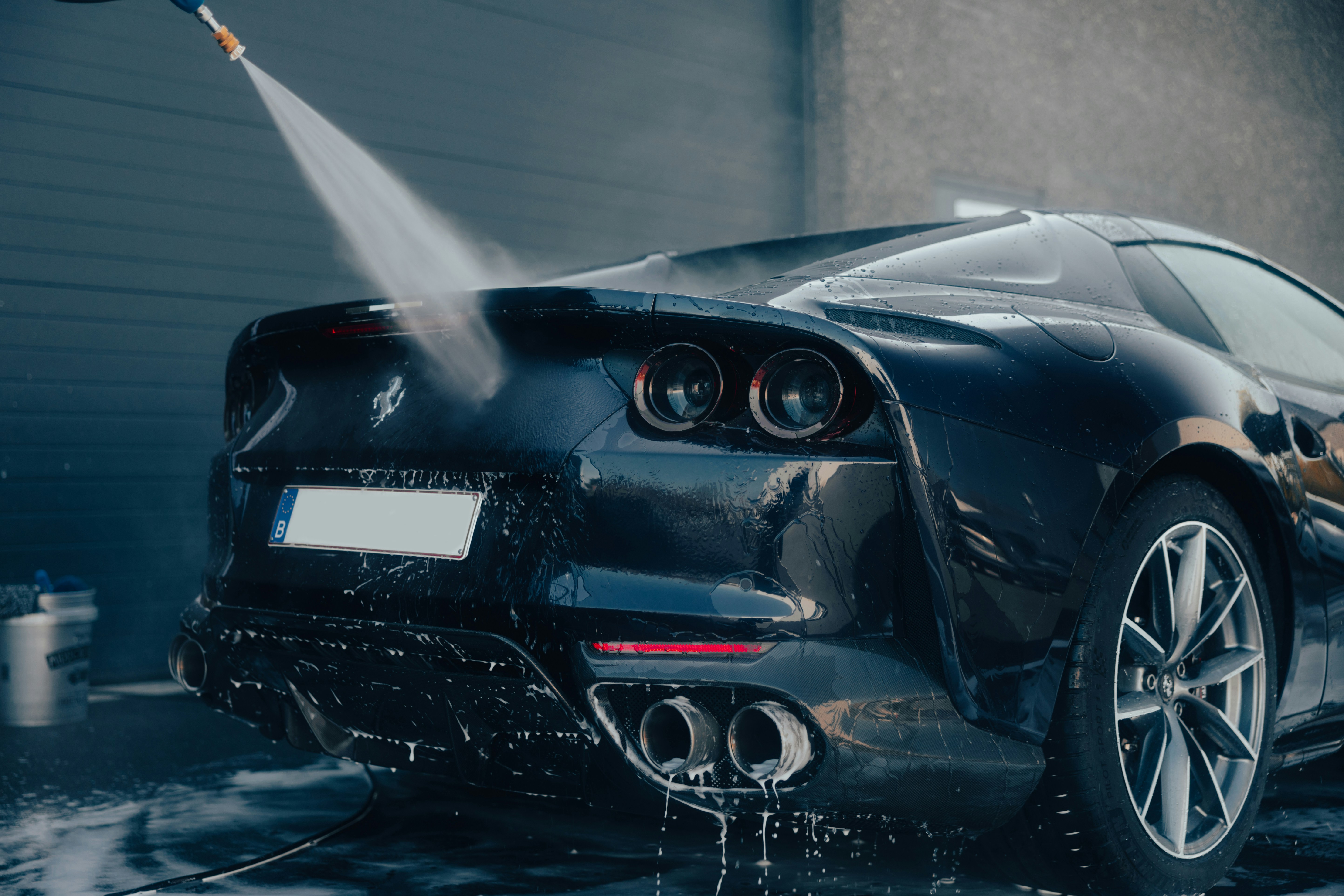 A car being washed with a high pressure washer photo – Free Car wash ...