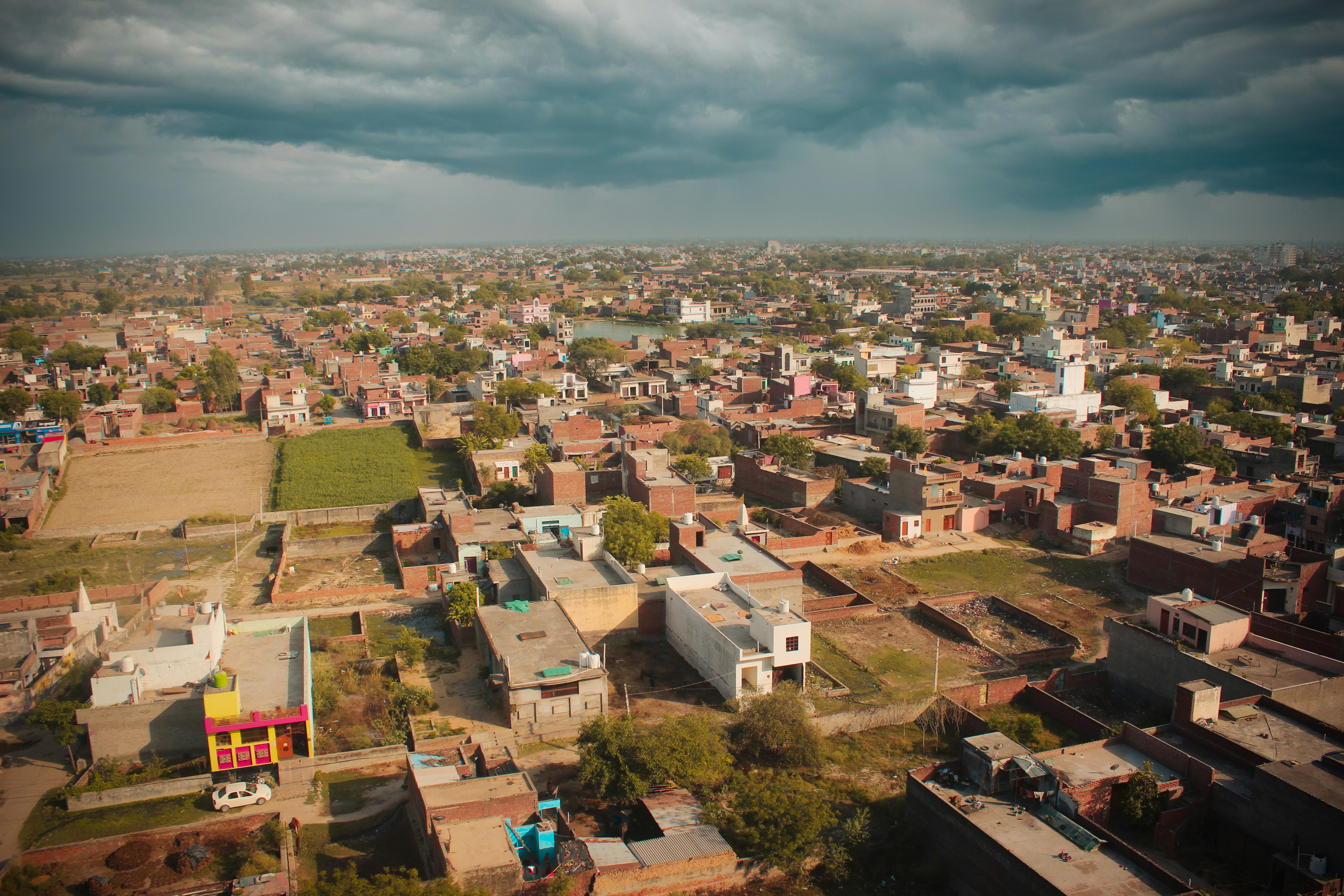 Patchwork Townscape Beneath a Looming Sky