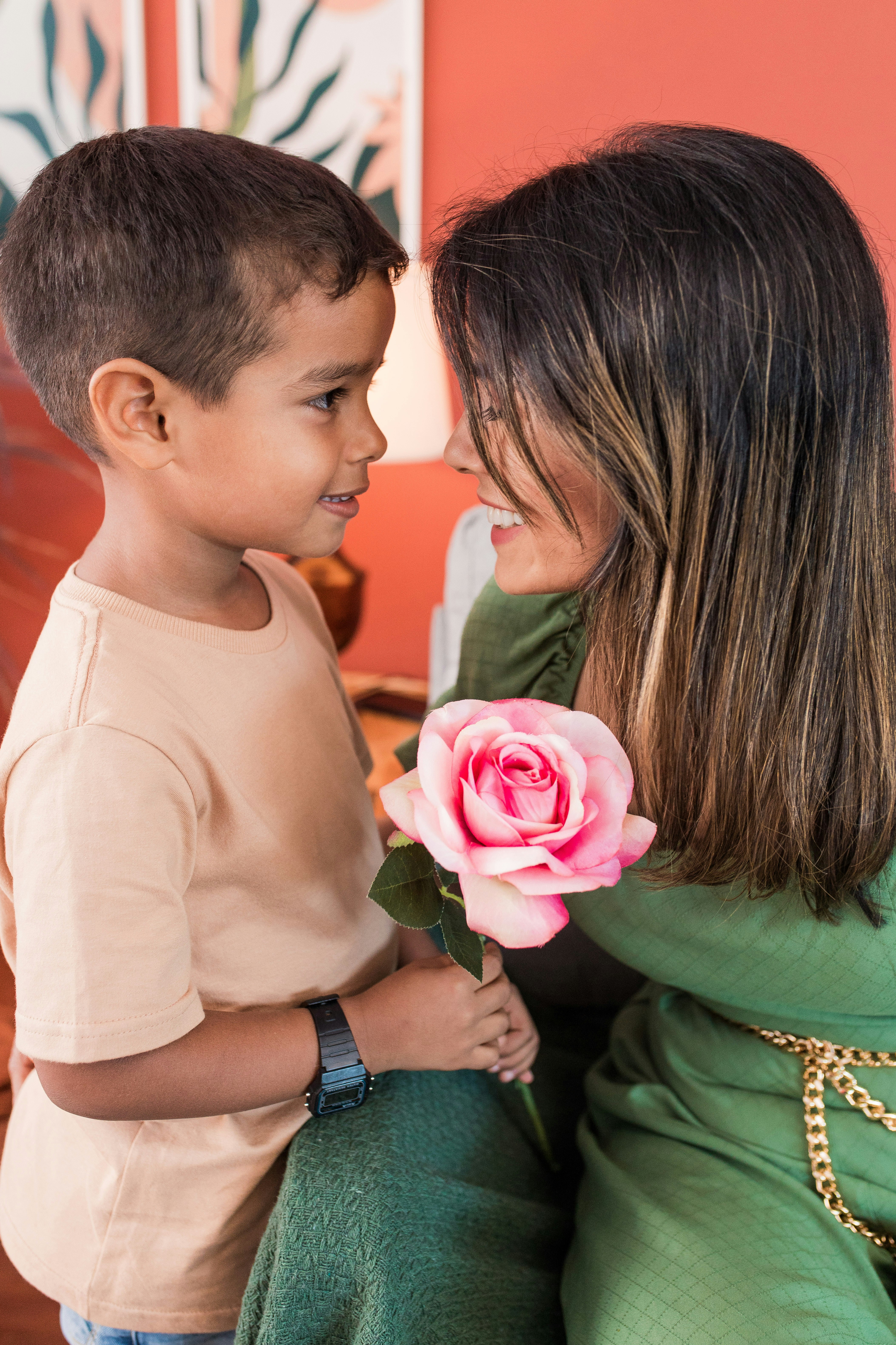 Rose-Soft Exchange: A Tender Moment Between Mother and Son