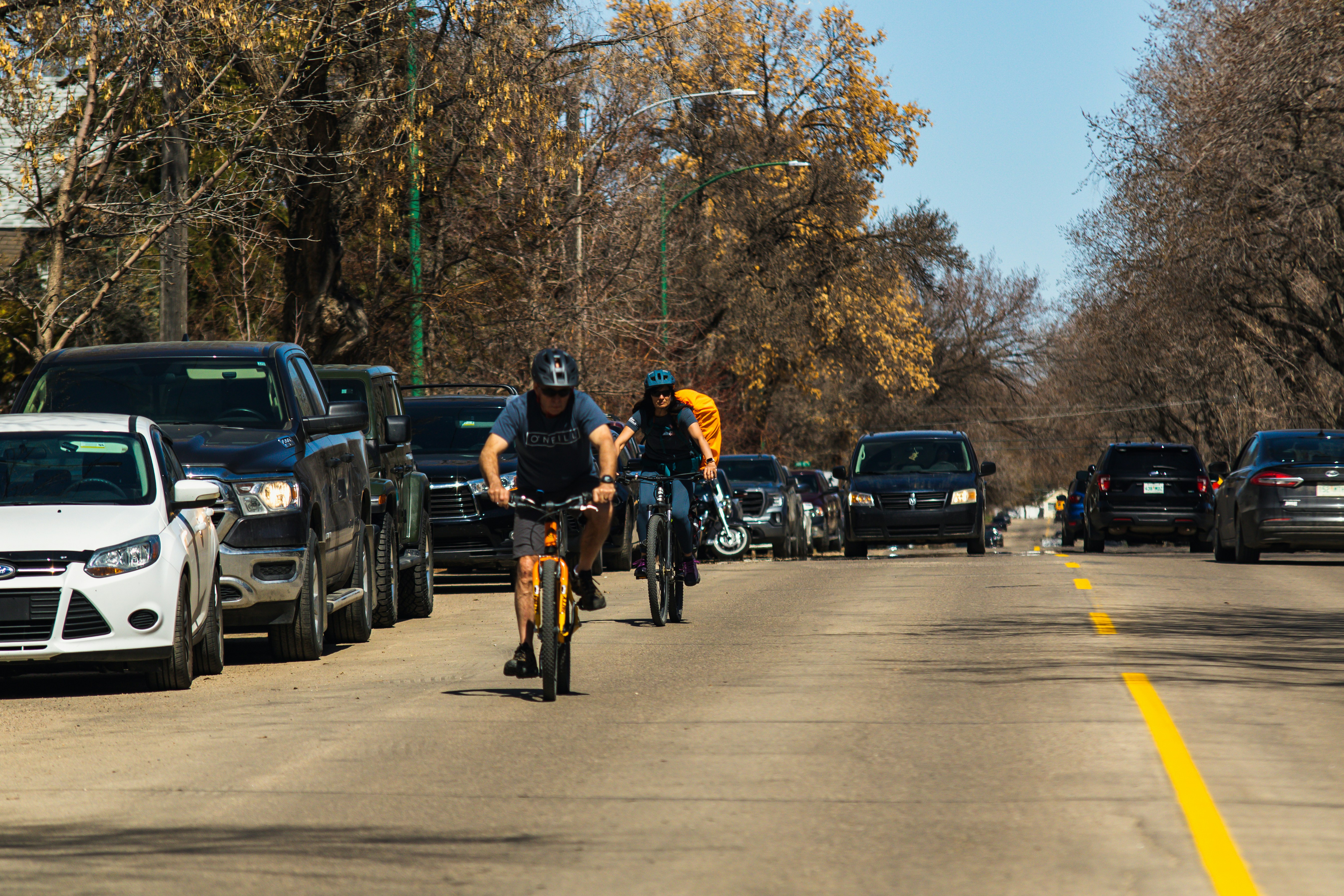 Urban Cyclists Navigate a Busy Street