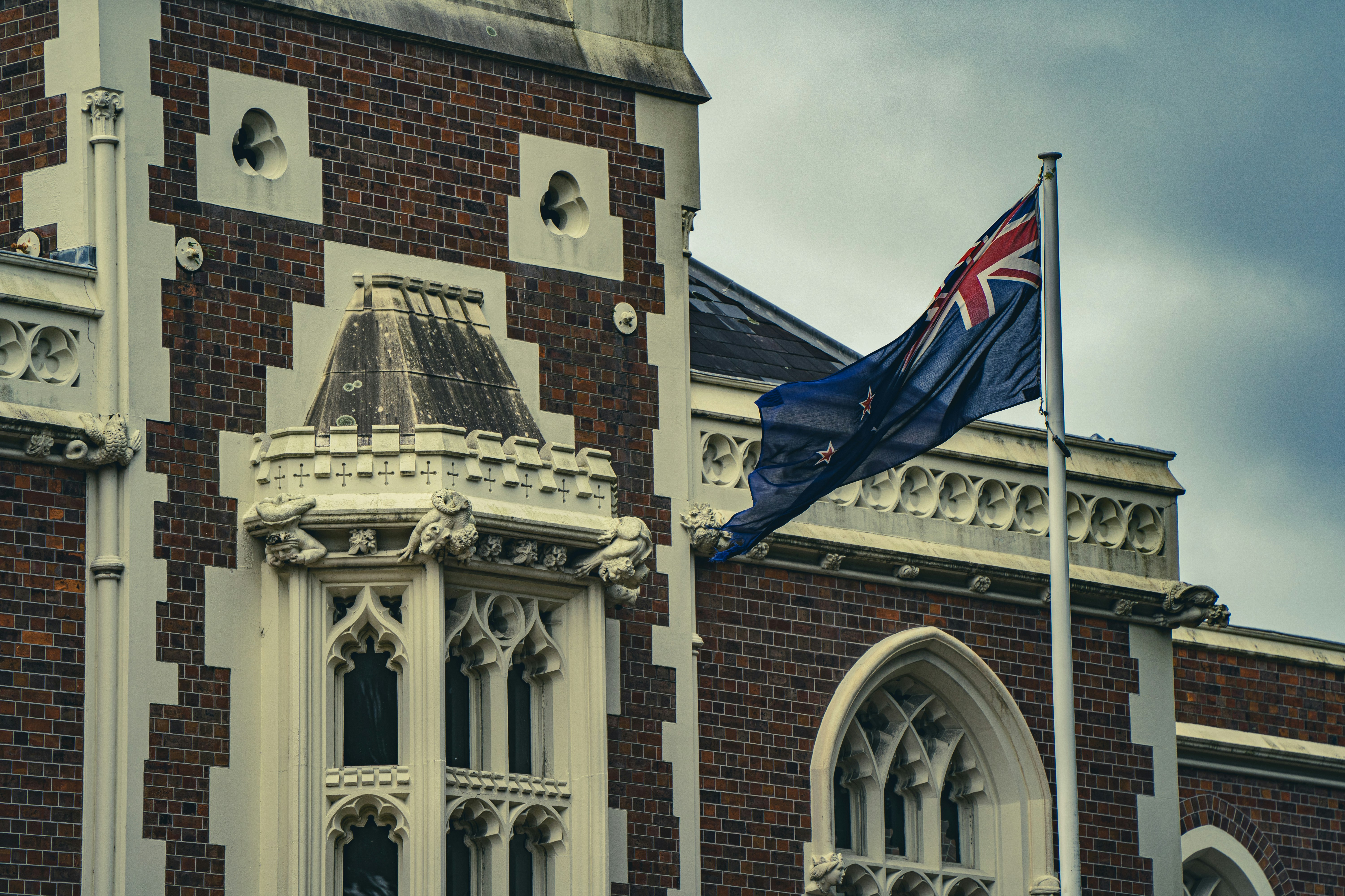 A british flag flying in front of a building photo – Free Building ...