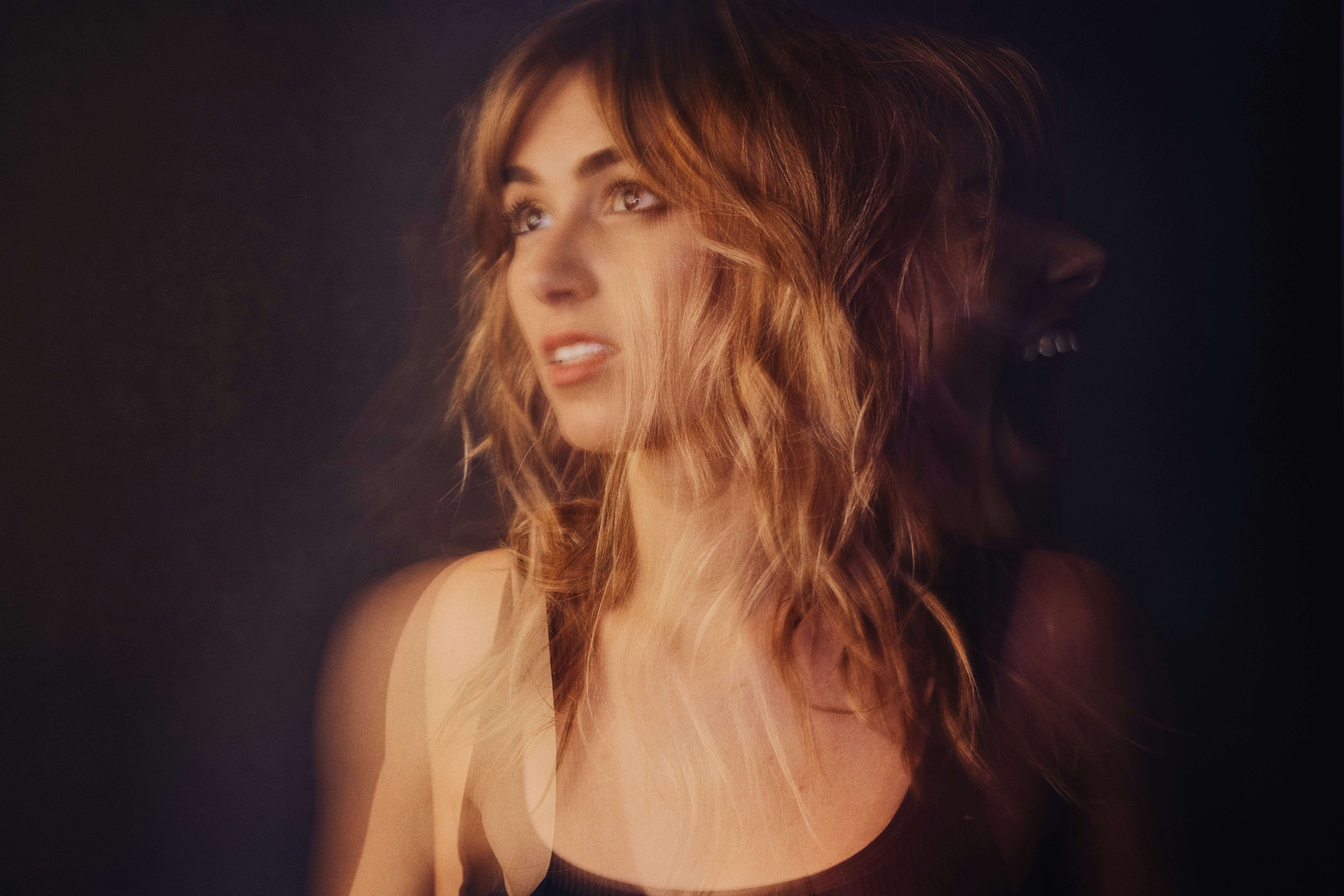 Echoes in Warm Light: A Double-Exposure Portrait