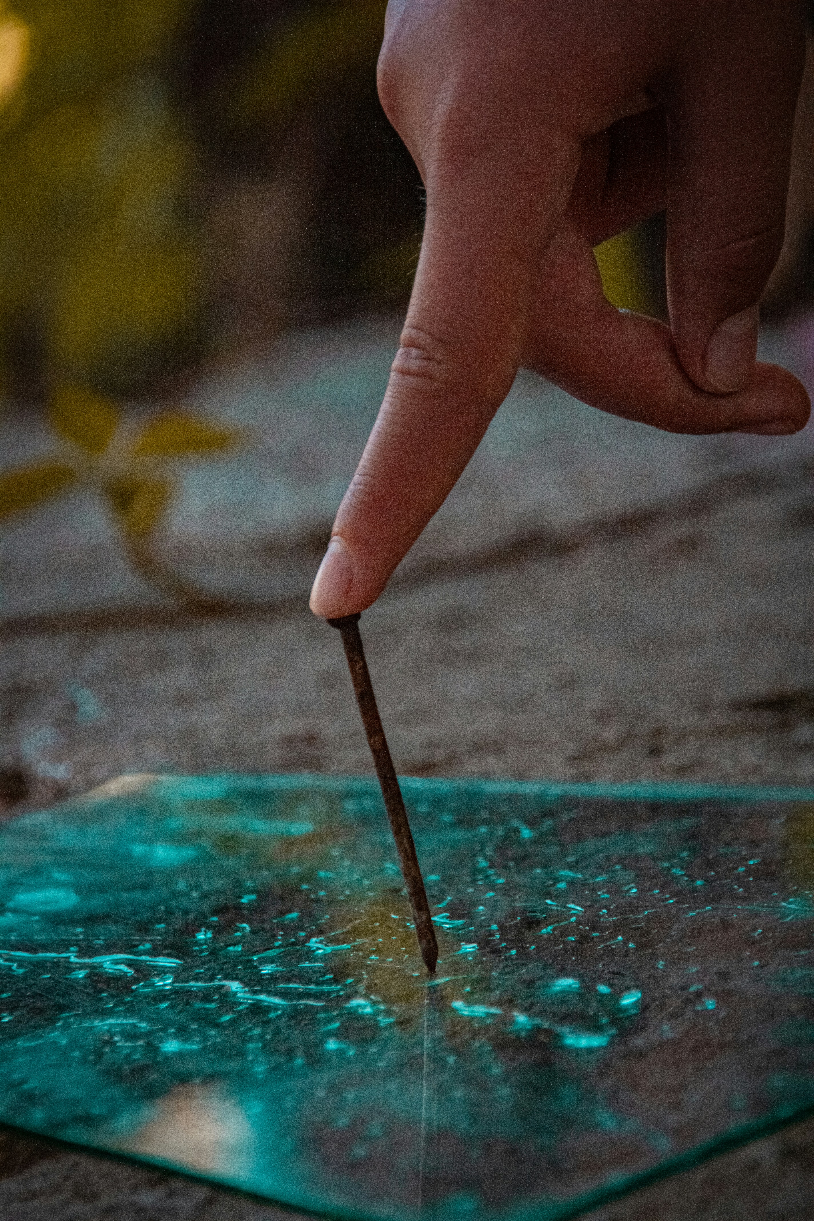 Tiny Pin, Turquoise Glass: A Micro Moment of Contact