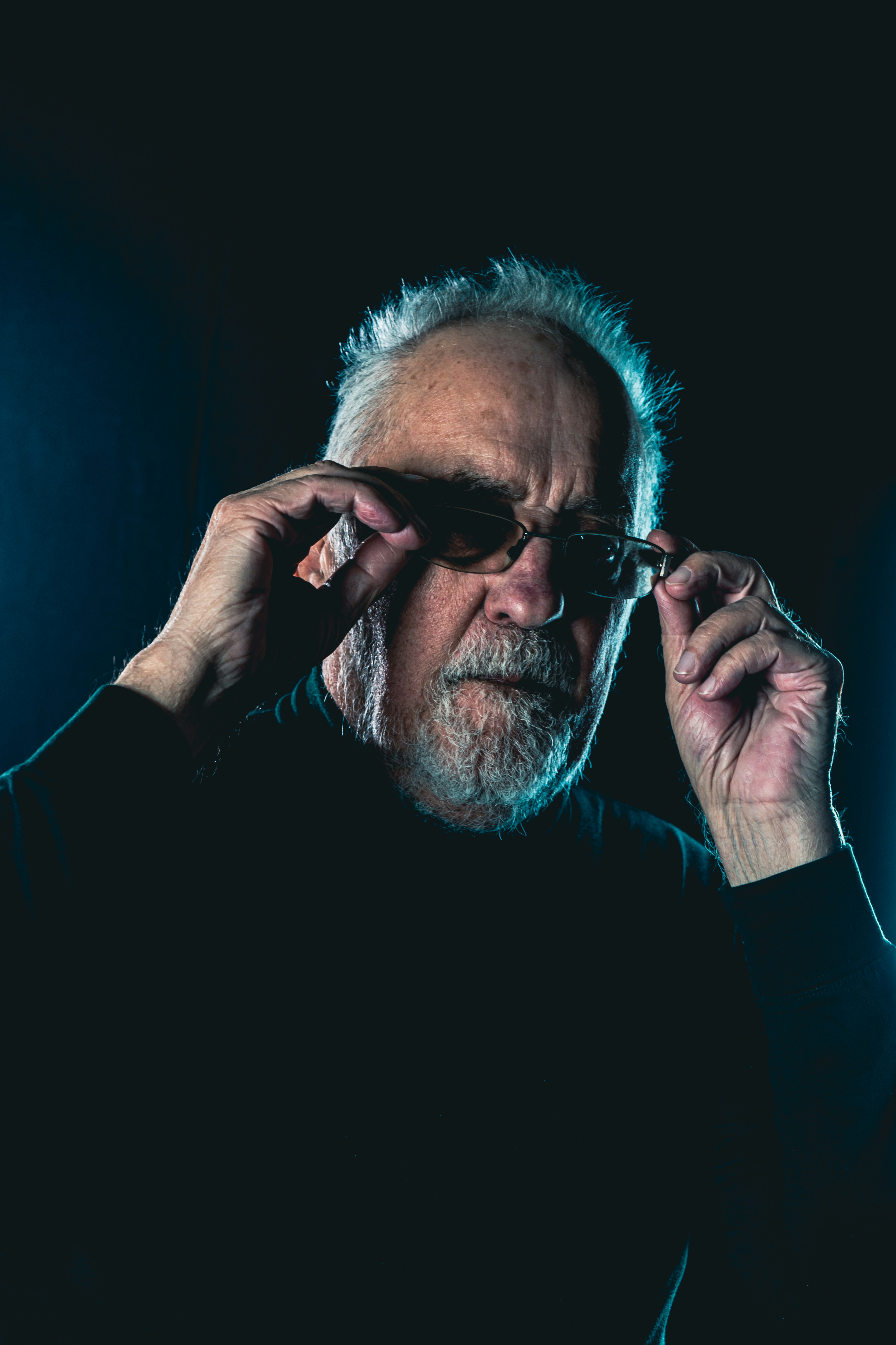 Intent in the Gaze: Portrait of Focused Glasses and Beard
