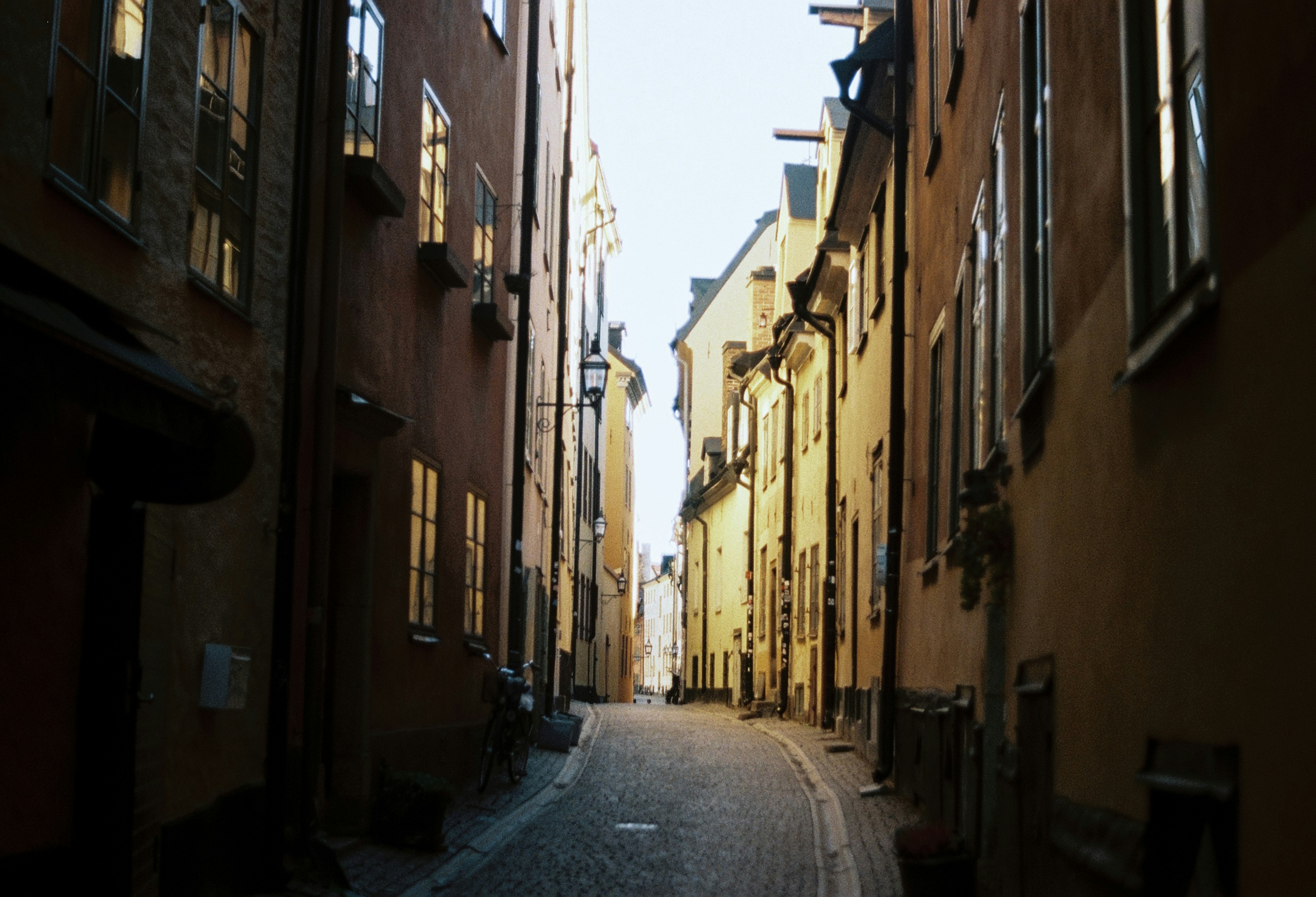 A narrow city street lined with tall buildings photo – Free Stockholm ...