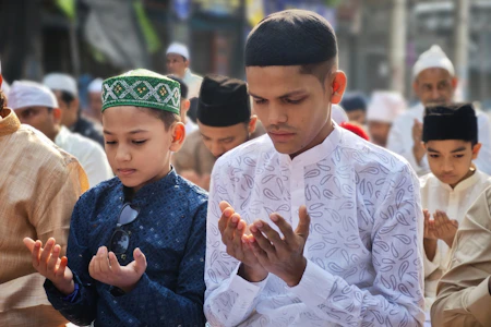 Concentrated Prayer: Youth in Traditional Garb United in Silent Supplication