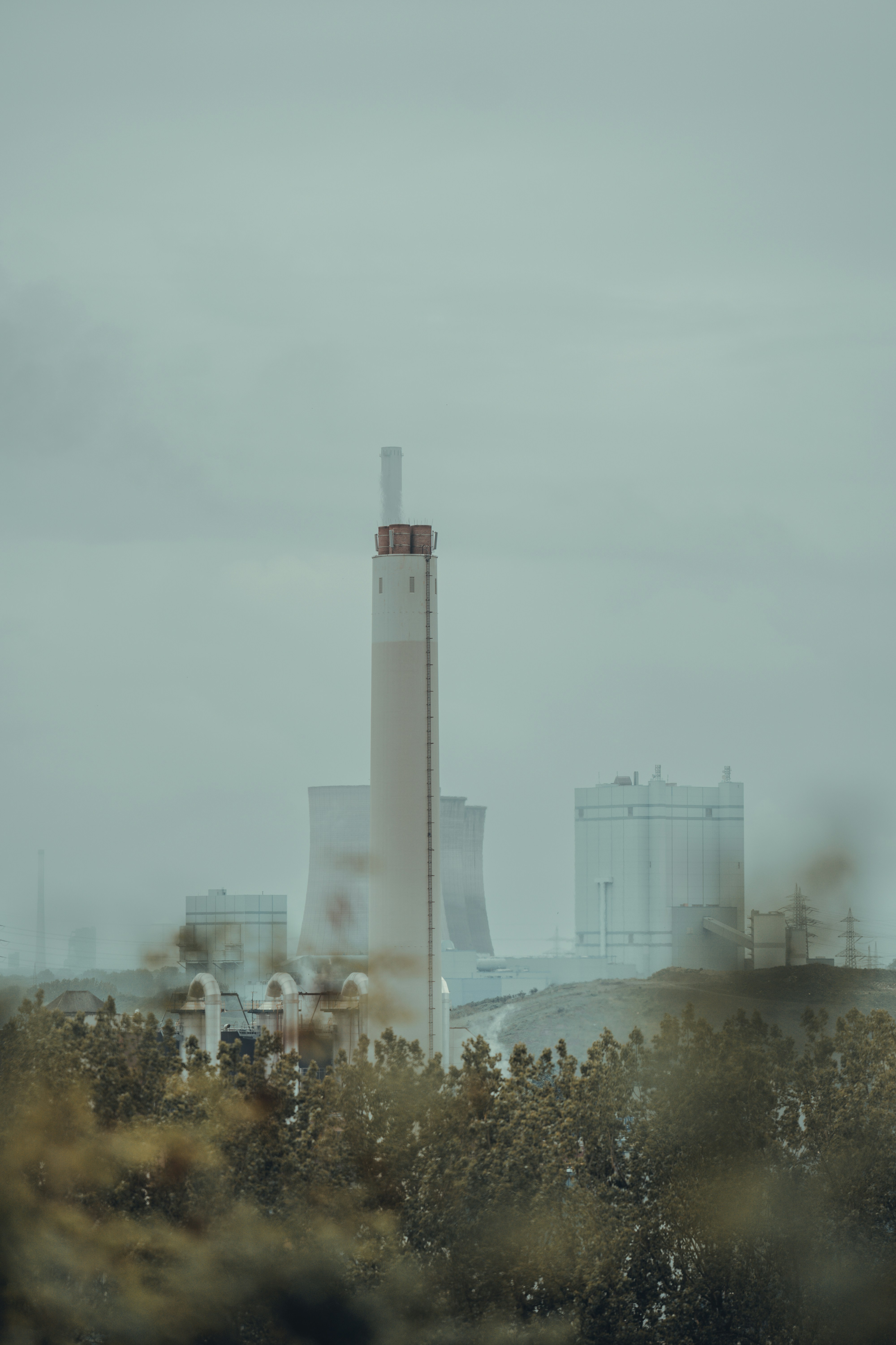 Central Chimney Rising Through Morning Haze