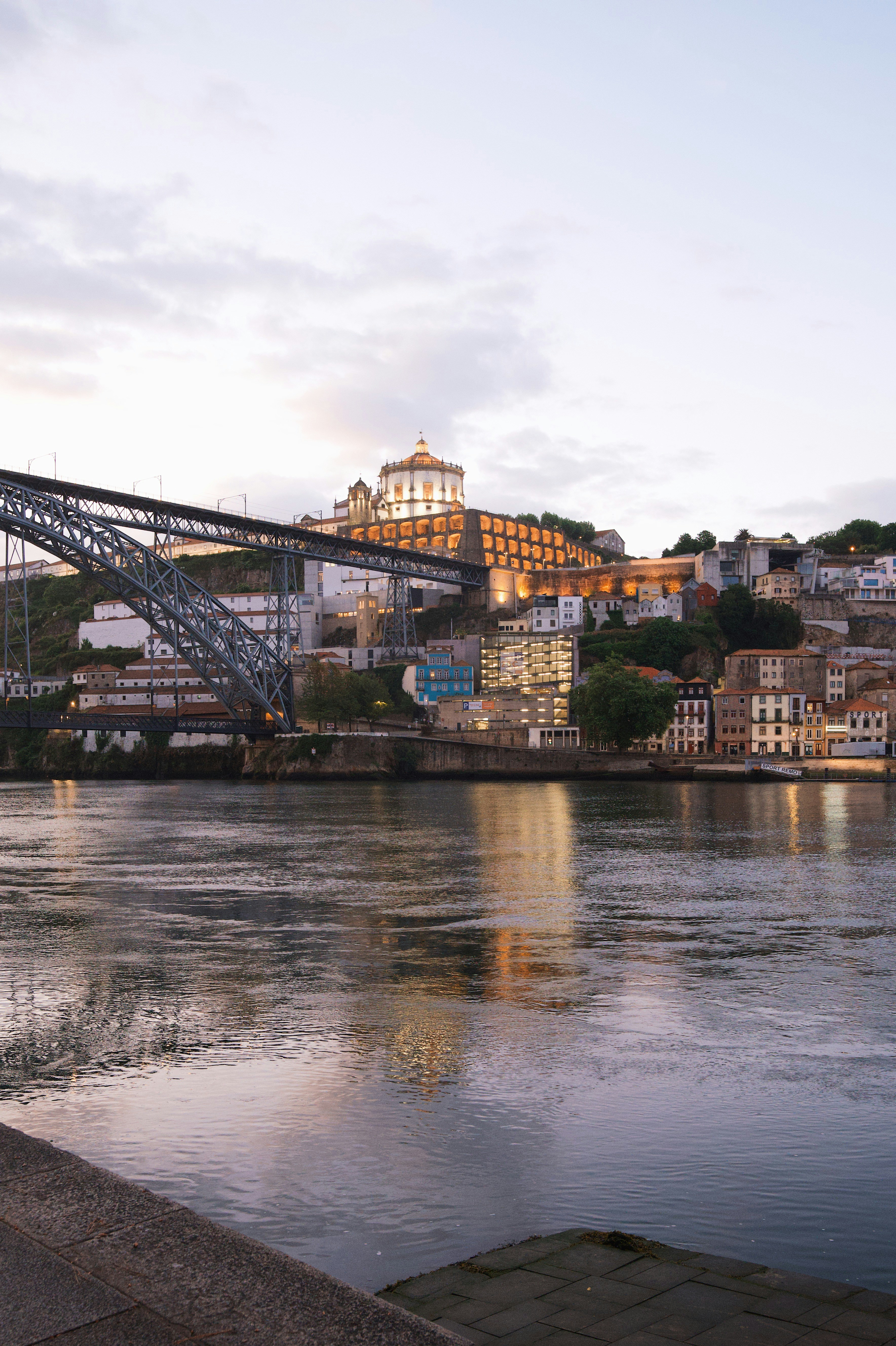 Douro at Dusk: Hilltop Sanctuary Illuminates Porto’s Iron Bridge