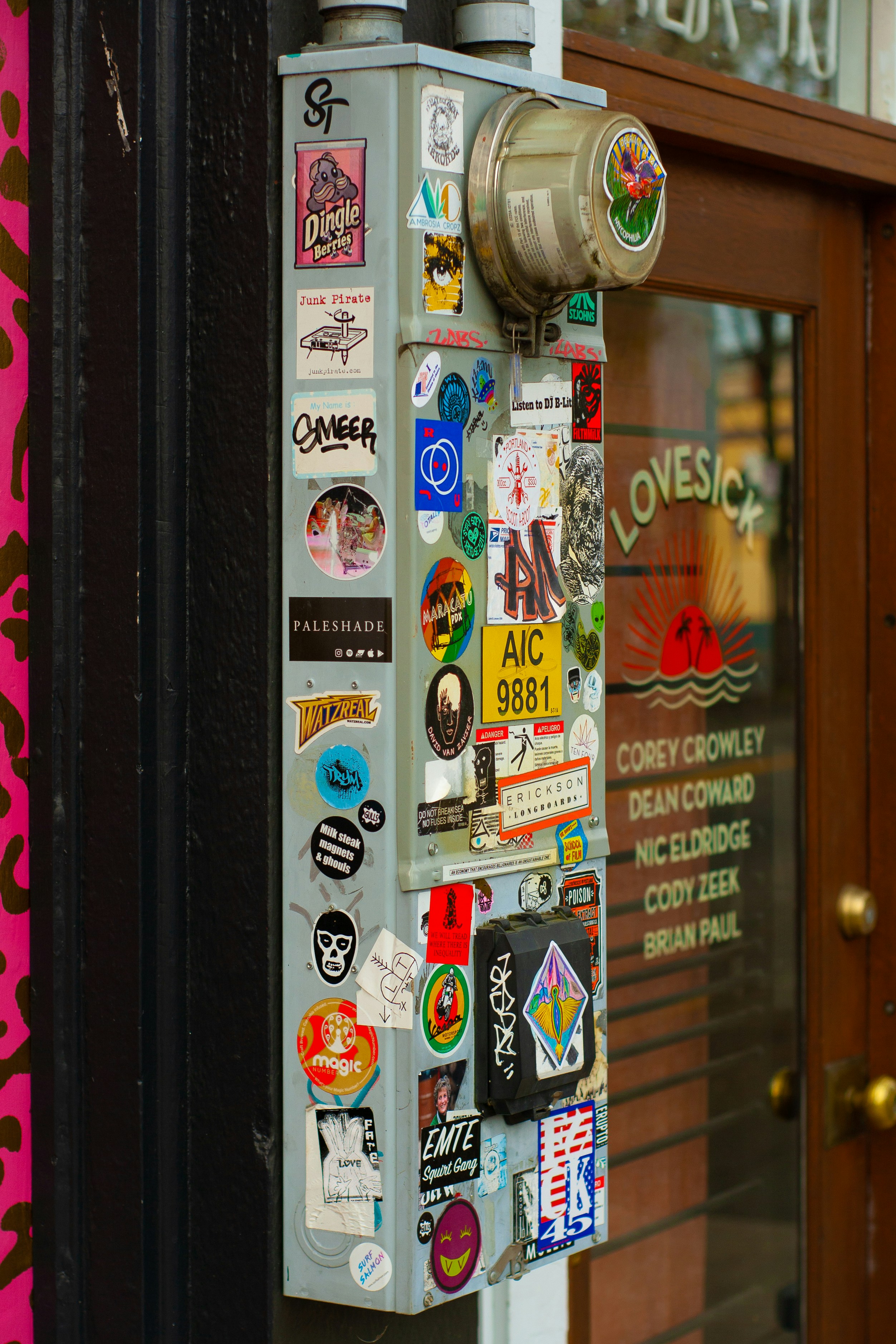 Stickered Column: A Portrait of Street-Level Expression at a Doorway