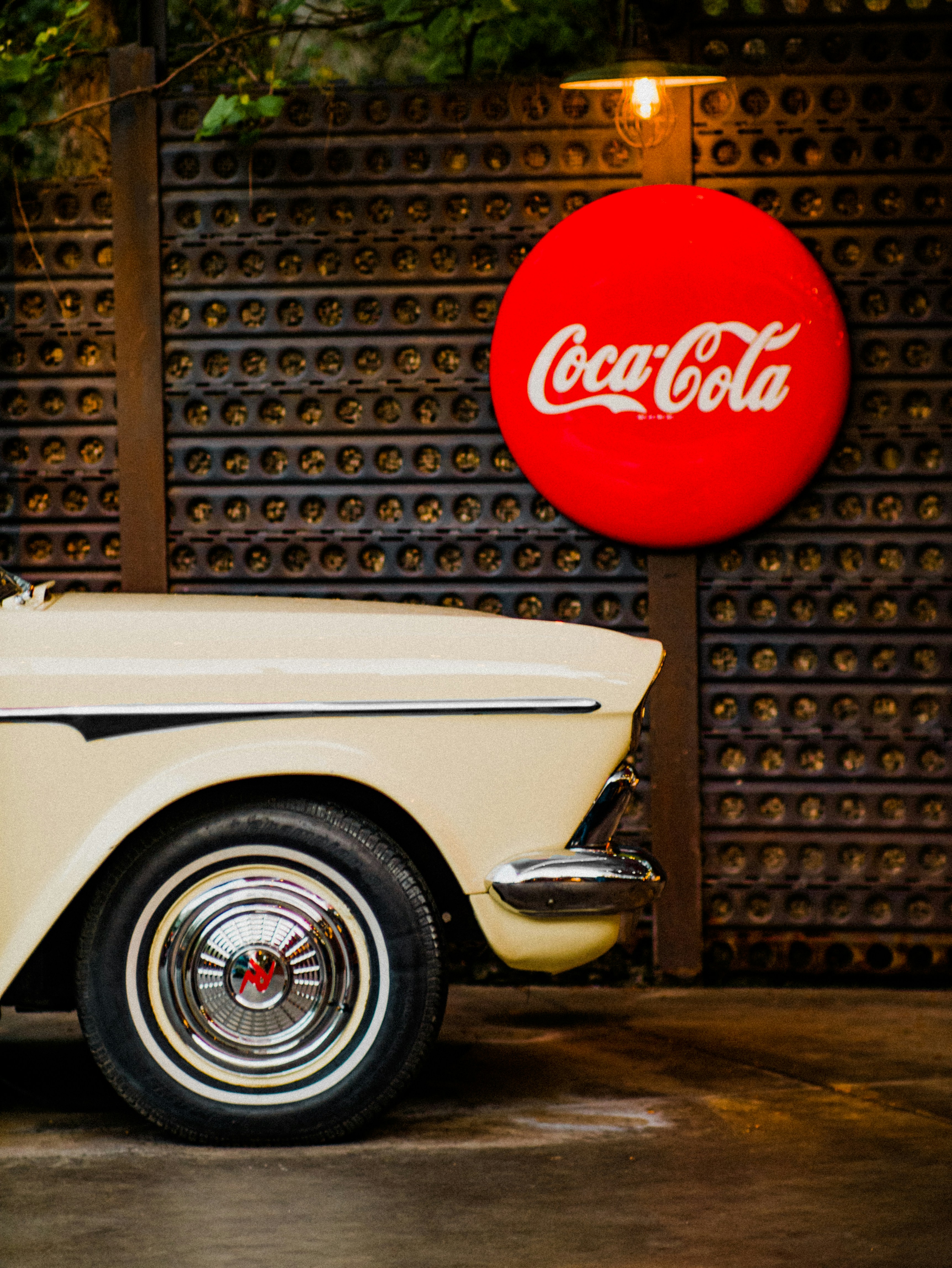 Red Circle, Classic Tailfin: A Coca-Cola Moment by the Wheel