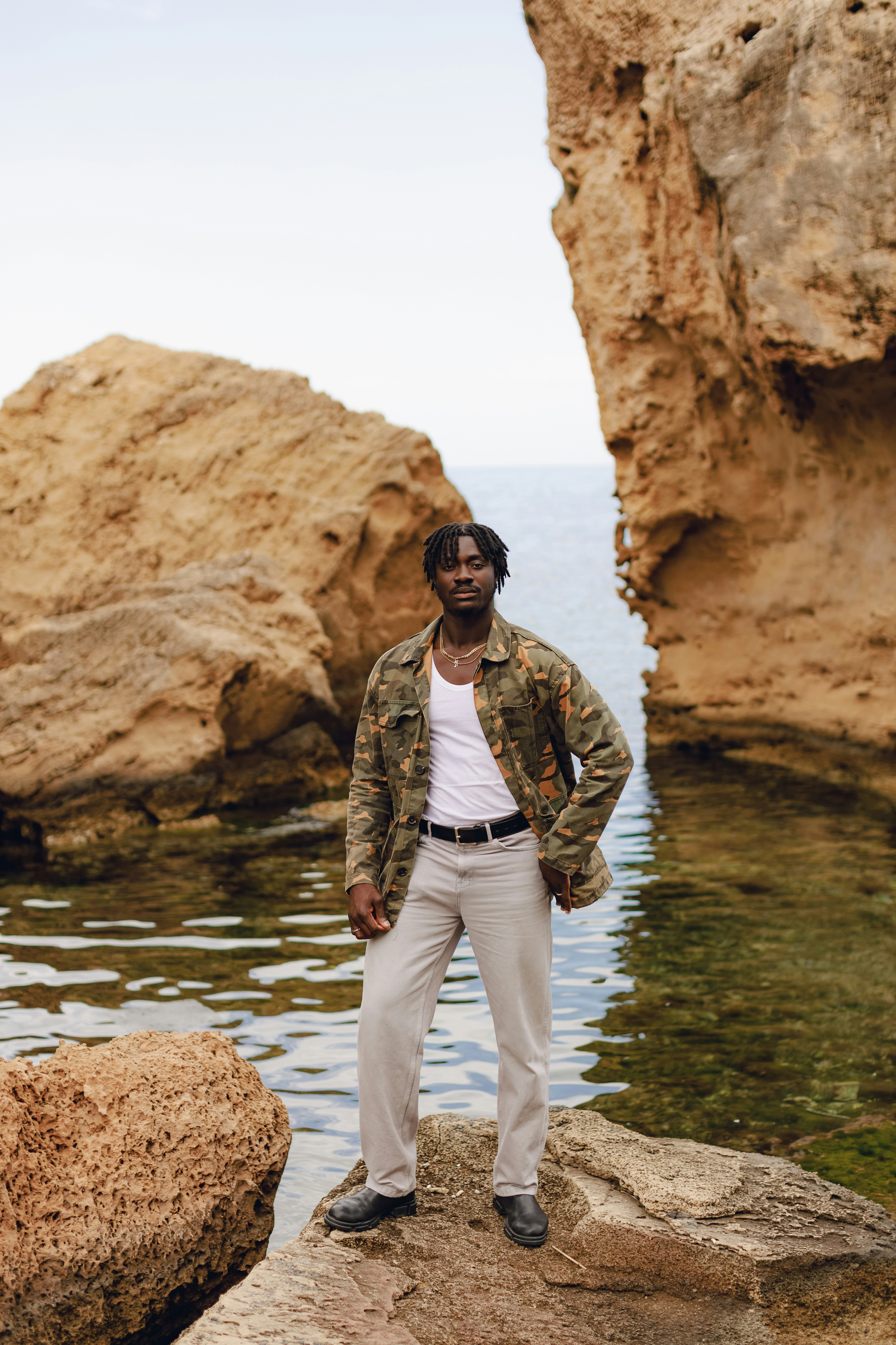 Coastal Confidence: A Portrait Beneath the Canyony Rocks