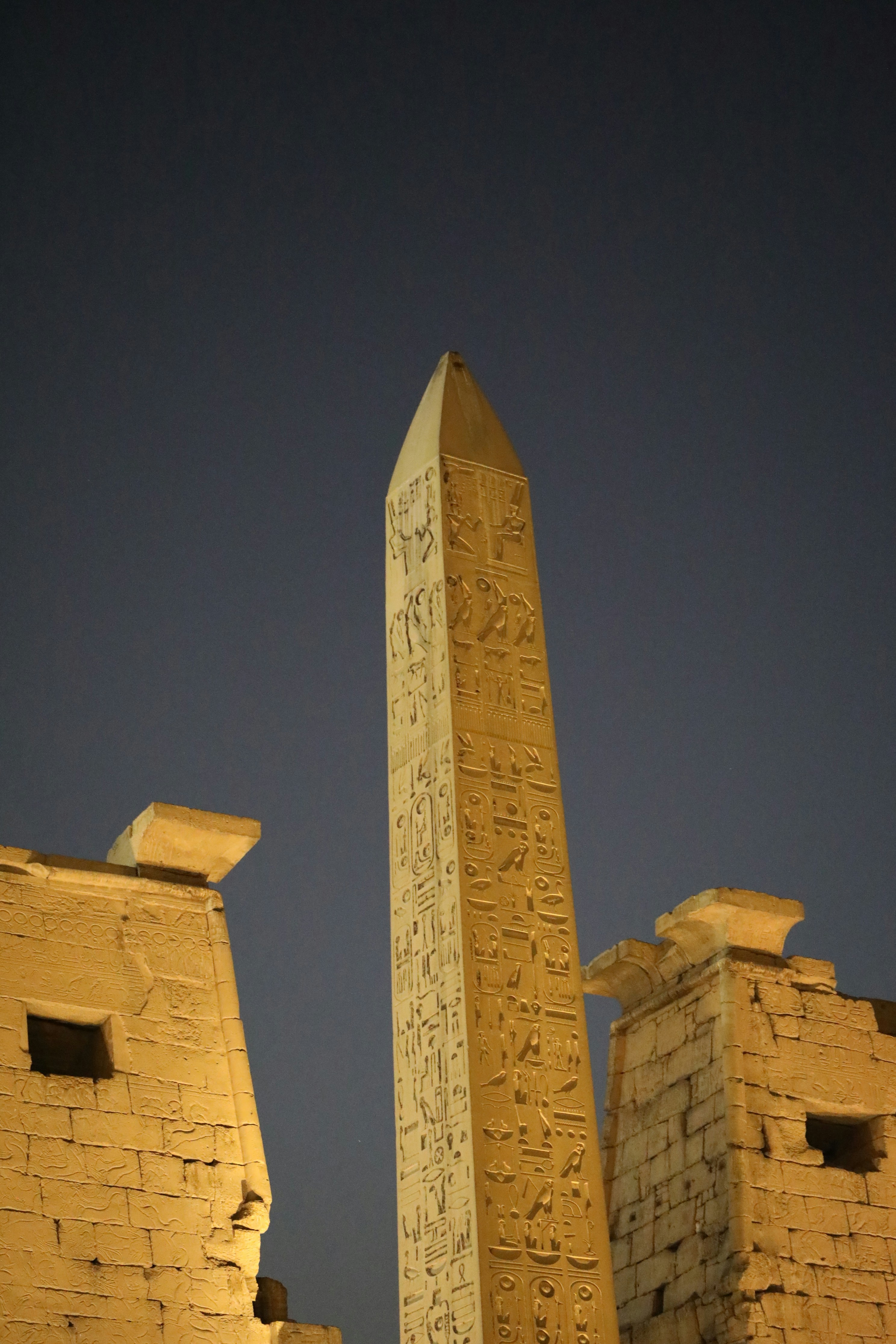 A tall obelisk with egyptian writing on it photo – Free Building Image ...