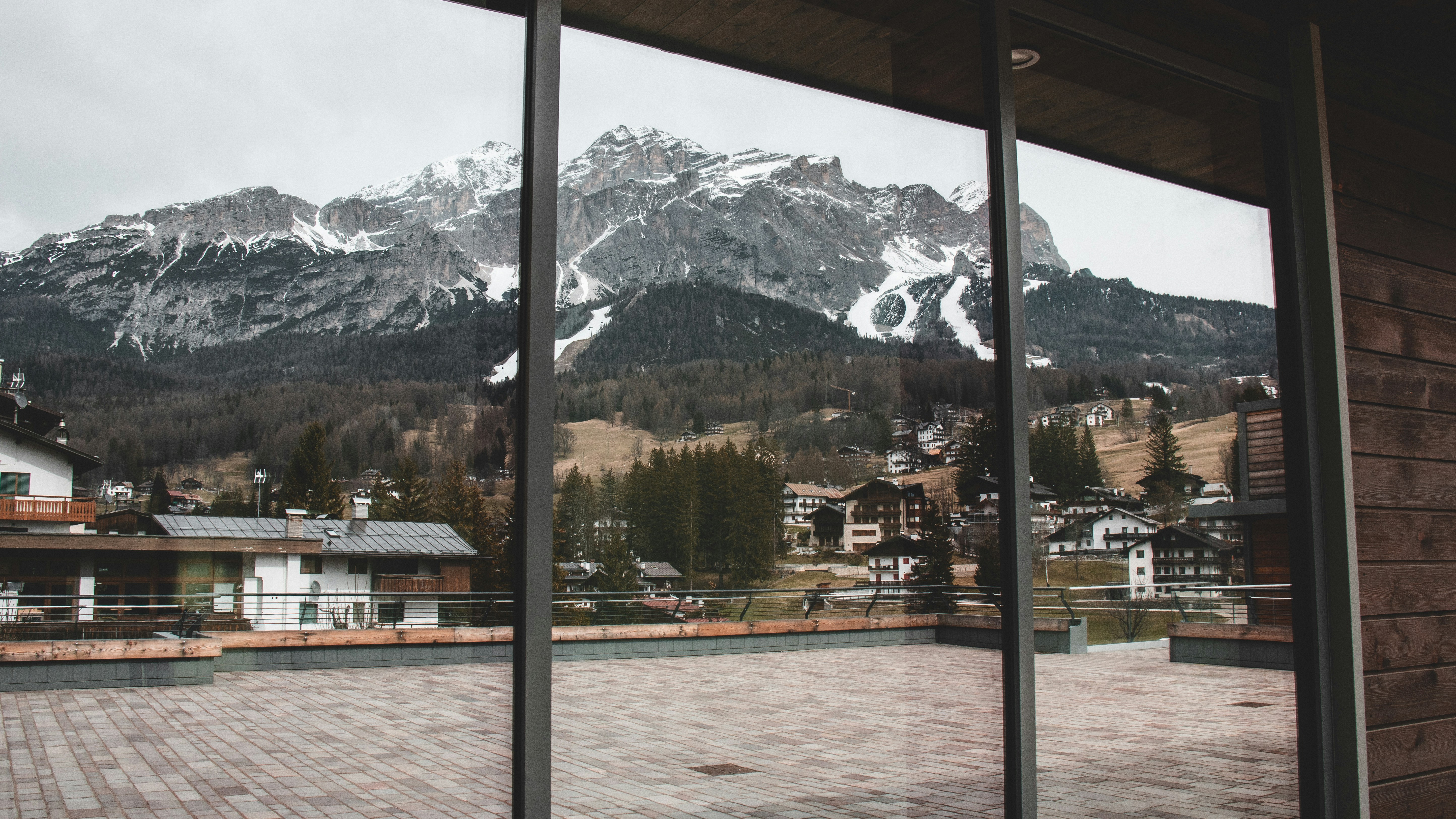 A view of a mountain range through a window photo – Free Dolomites ...