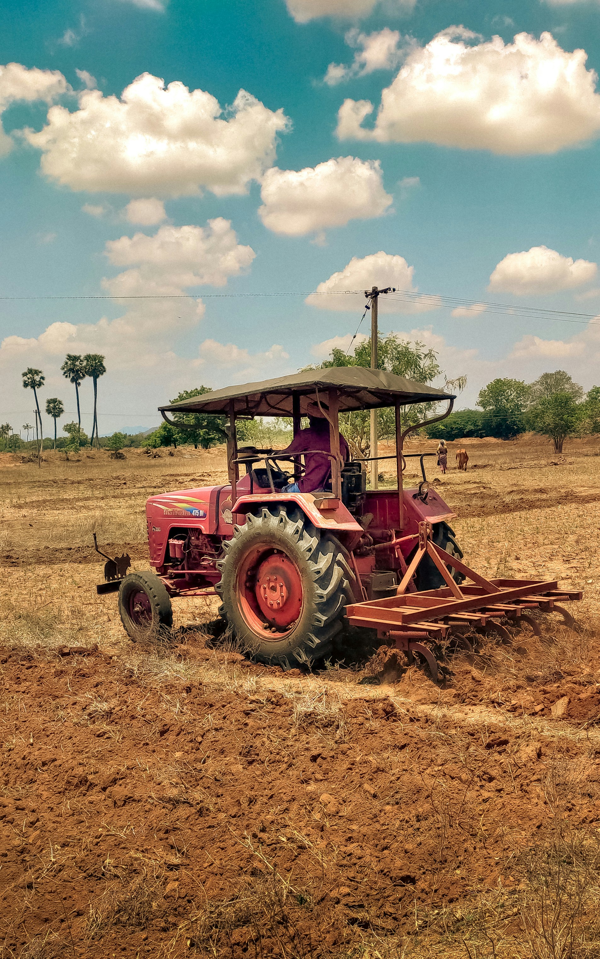 Farm equipment working on a field