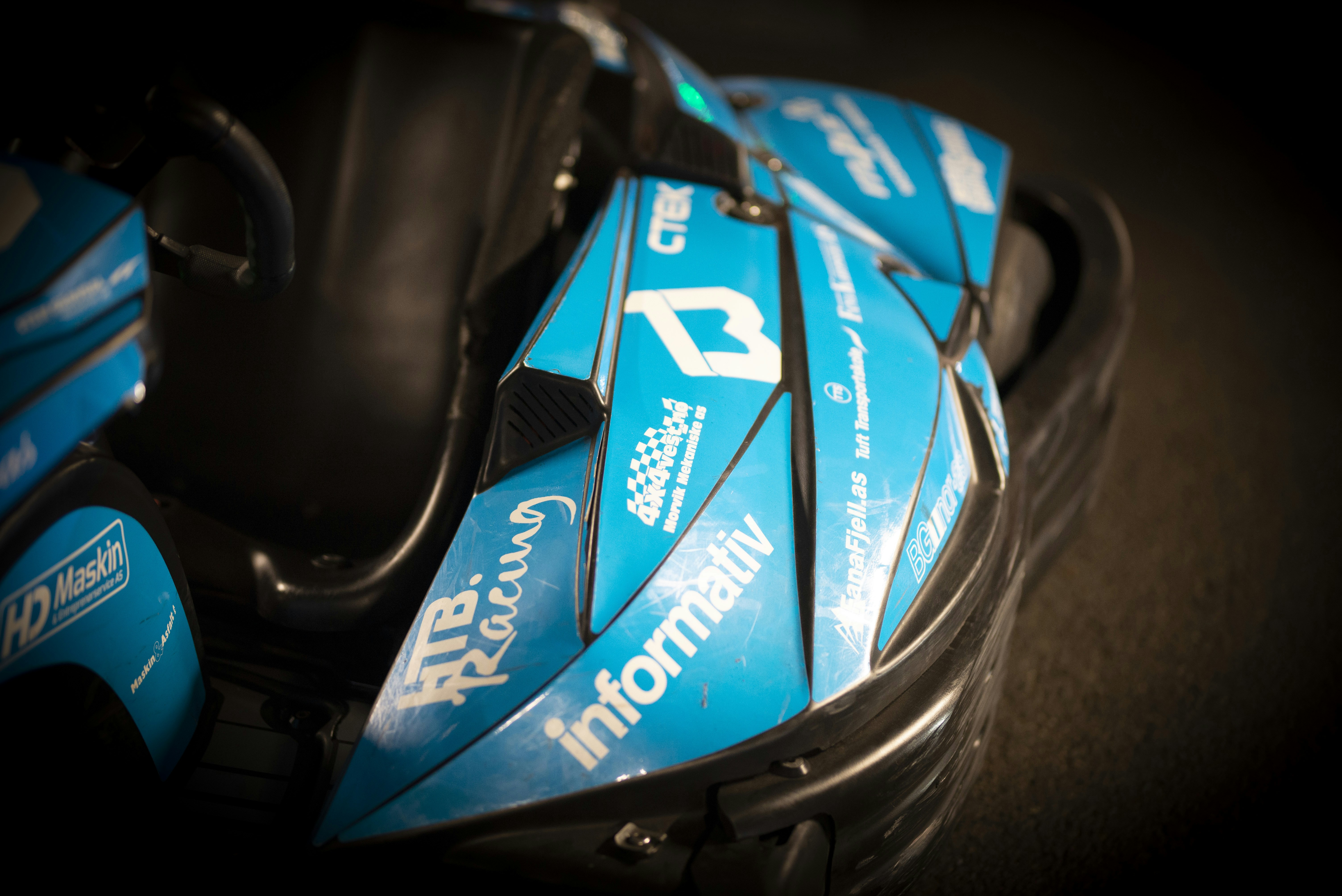 Blue Racing Gear: Close-up of a Helmet Visor and Branding