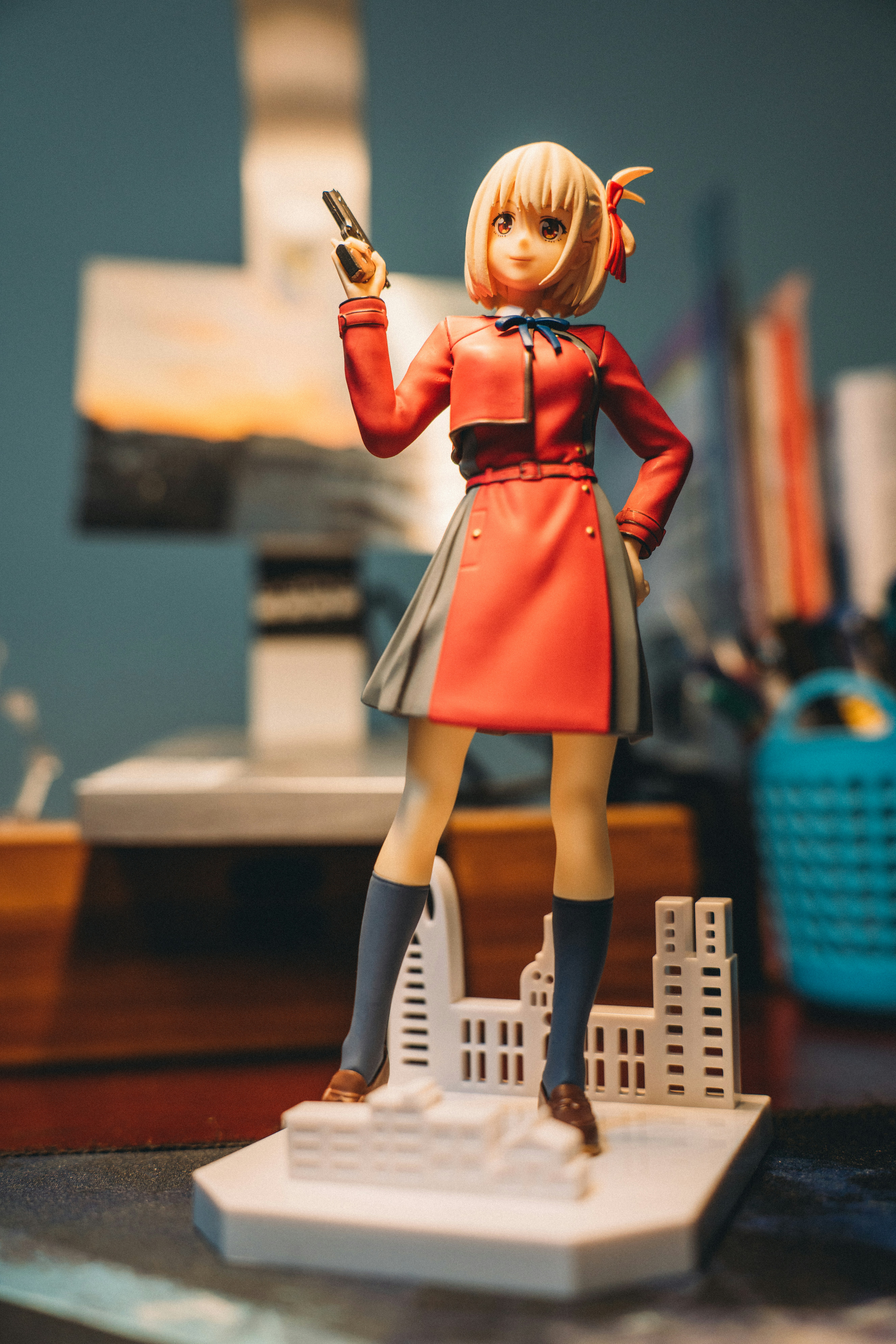 Red-Coat Sentinel Over a Miniature City