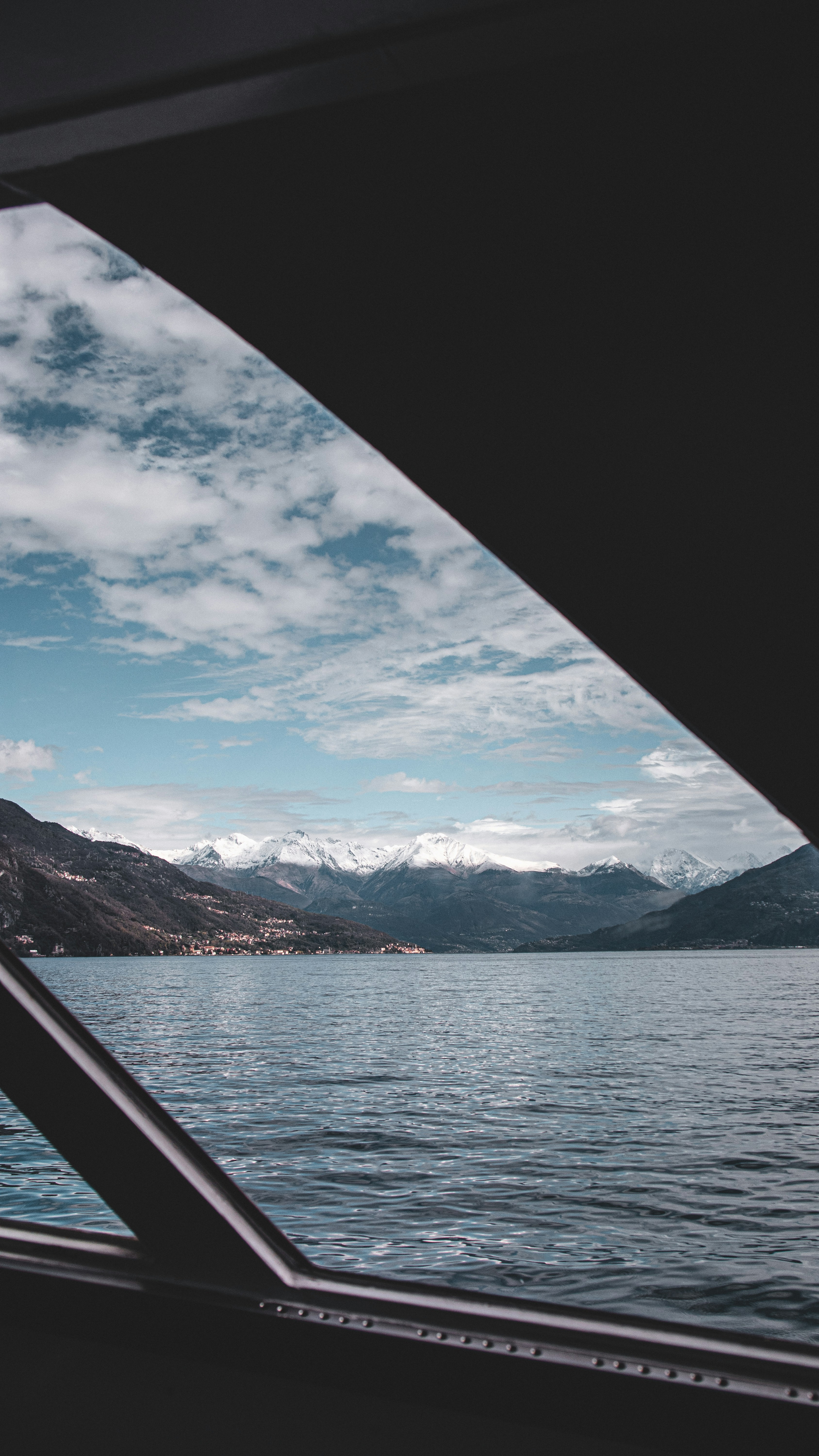 A view from inside a boat of a lake and mountains photo – Free Lake ...
