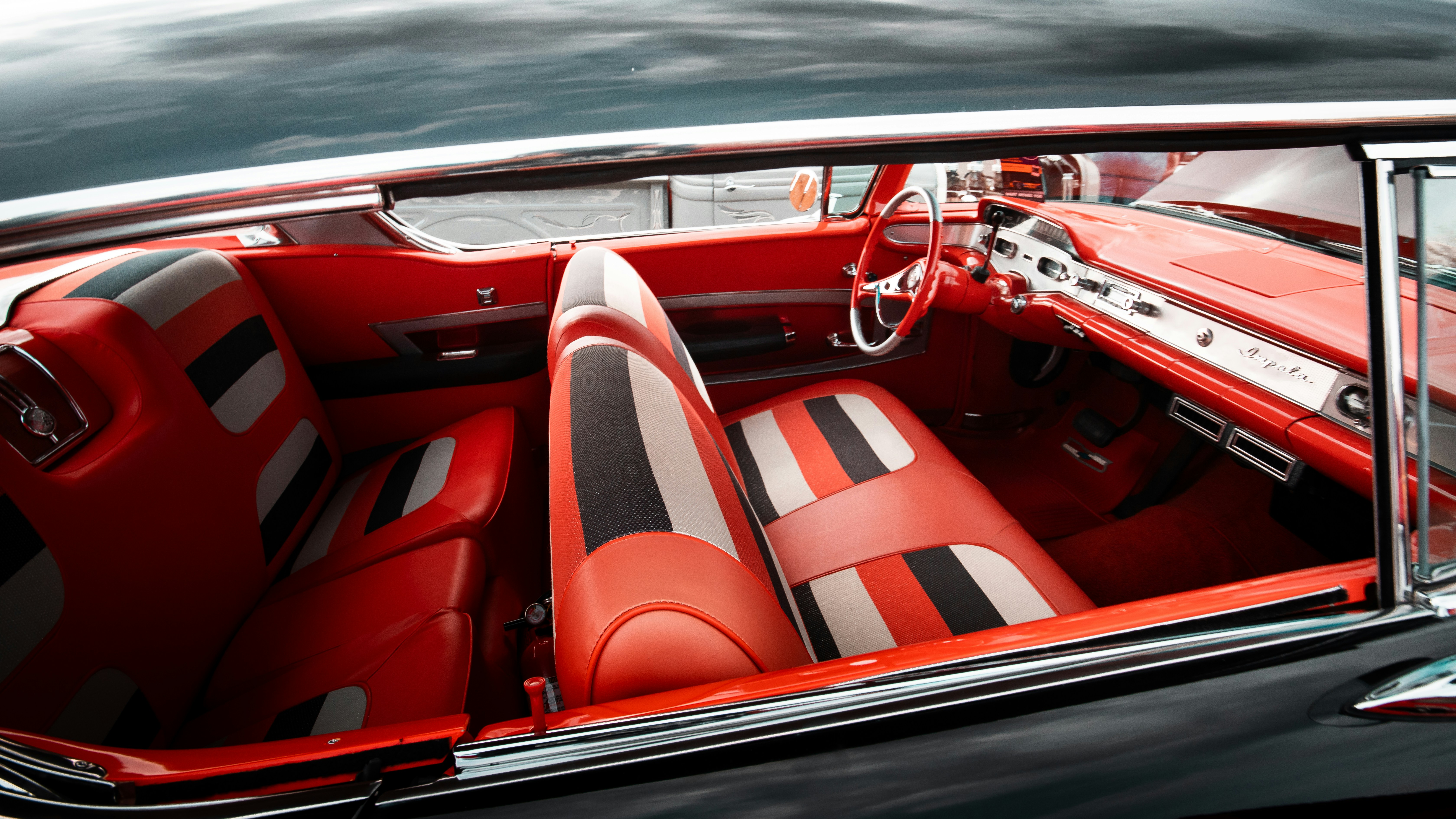 Crimson Cabin: Inside a Vintage Convertible's Bold Red Interior