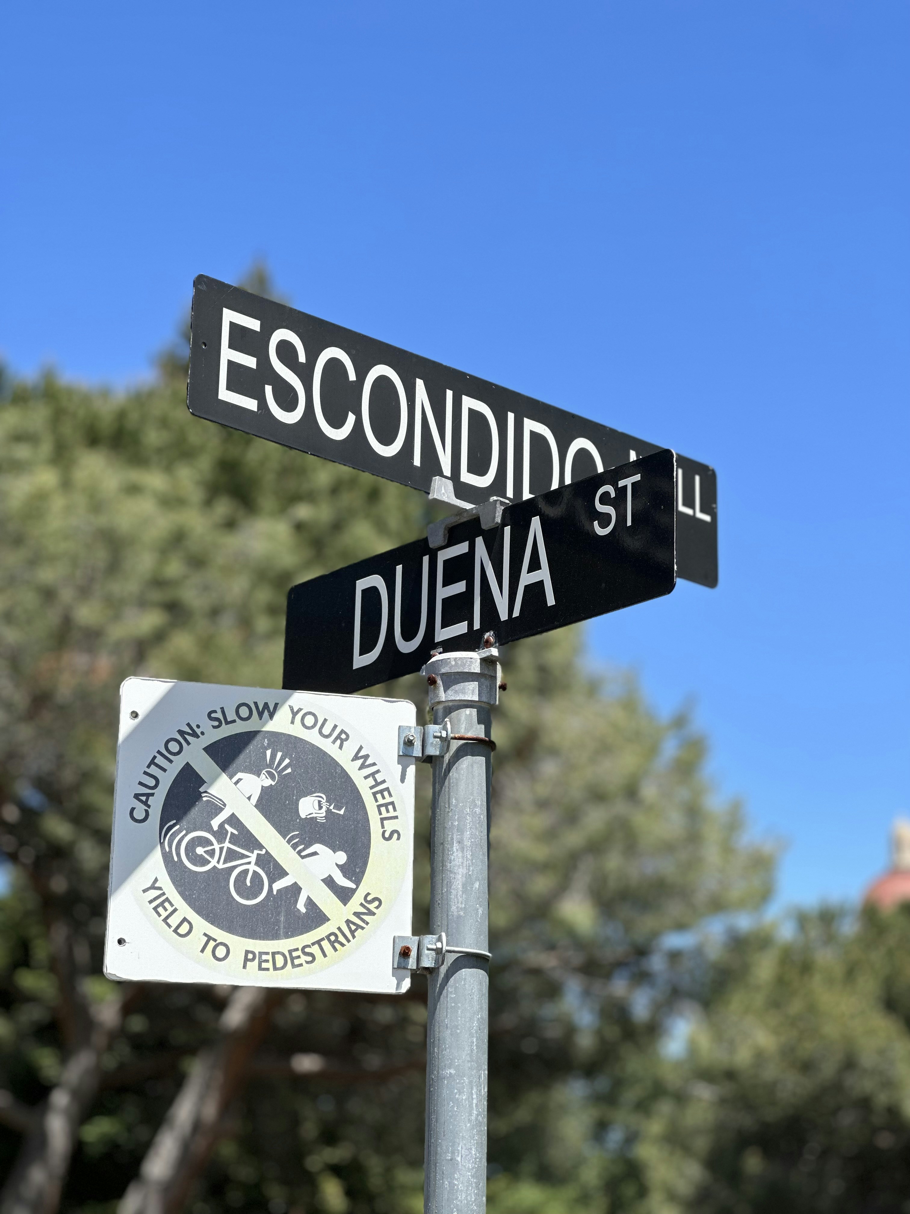Street Sign Tango: Escondido Meets Duena under a Clear SoCal Sky