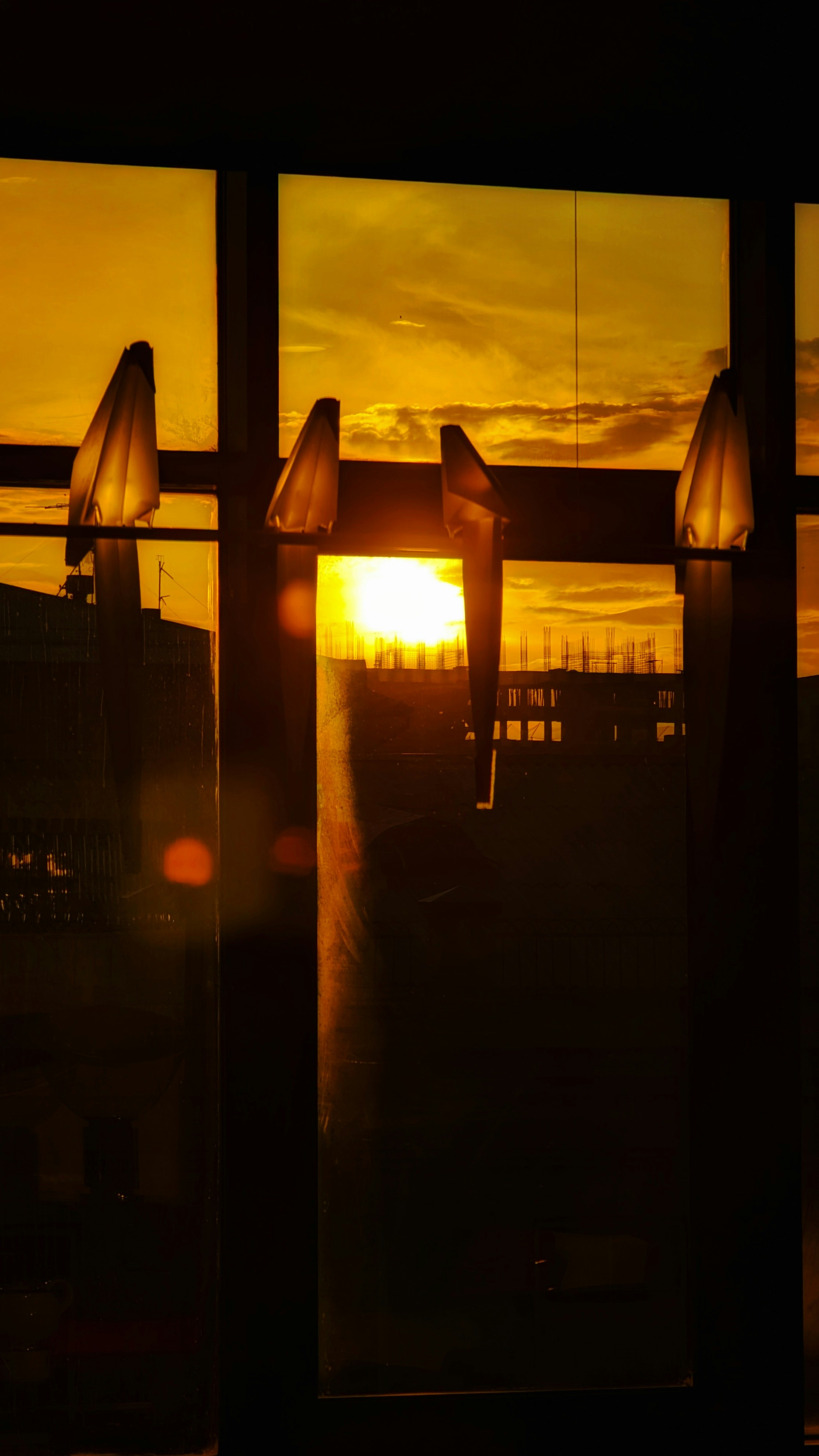 Golden Hour Through Glass: Sunlight Framing the Window Grids