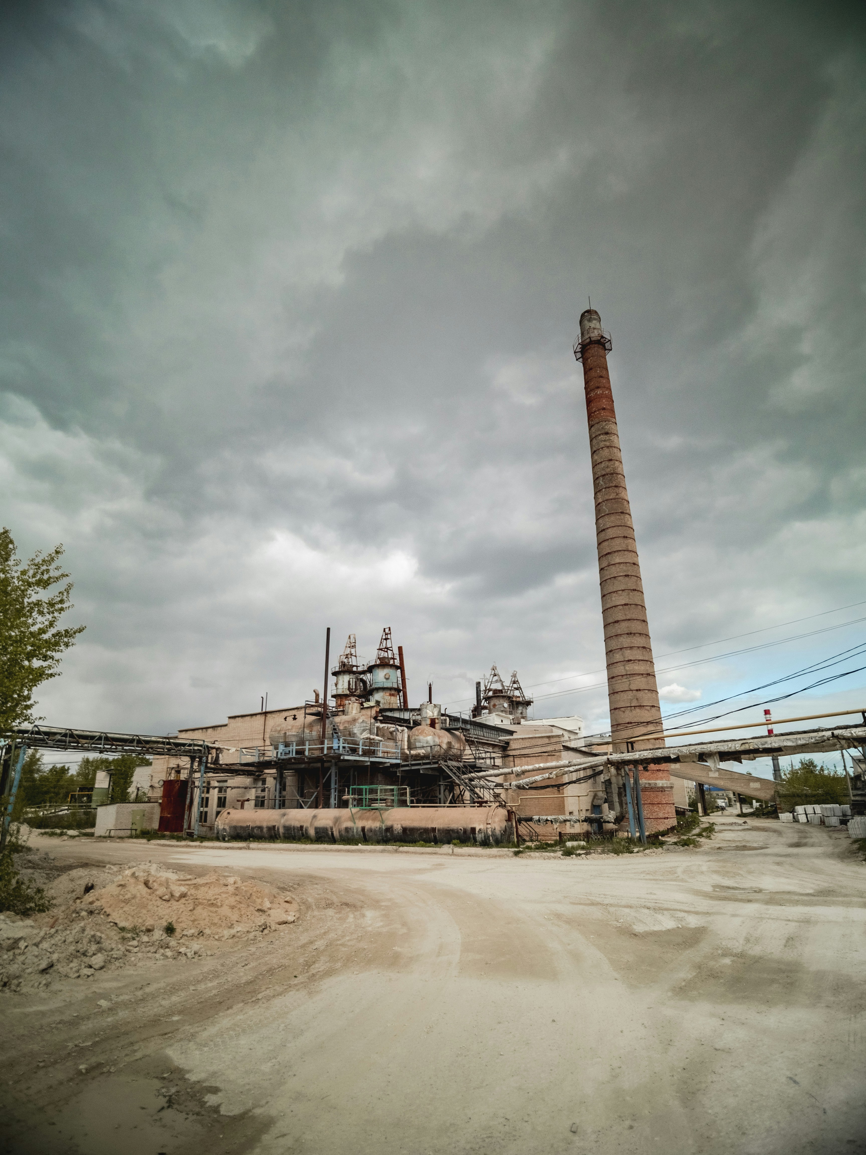 The Brick Chimney: A Quiet Monolith Amid Industrial Ductwork